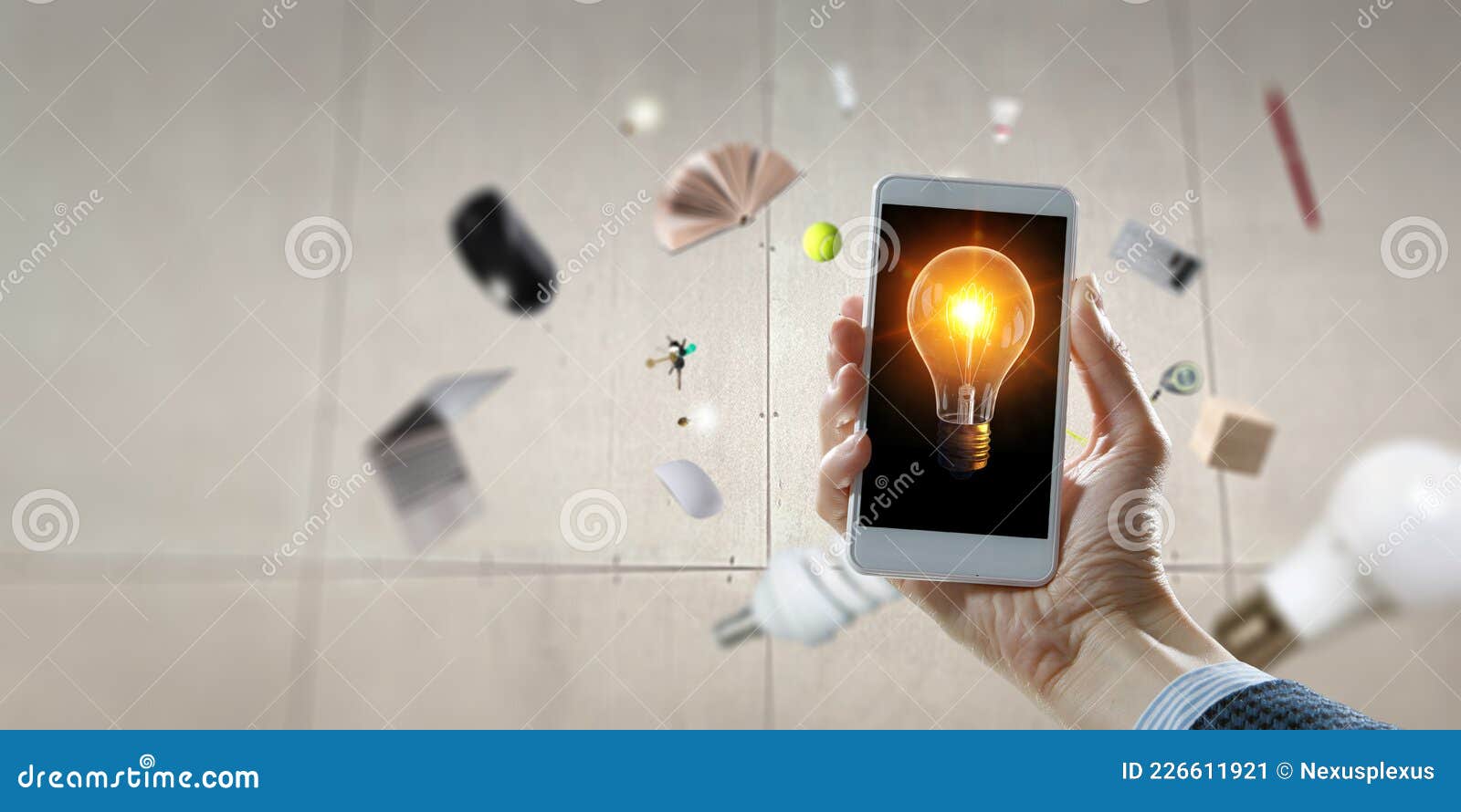 Light Bulb on Phone Screen . Mixed Media Stock Image - Image of ...