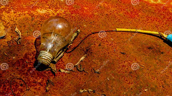 Light Bulb on Rusty Zinc As a Background Stock Photo - Image of ...