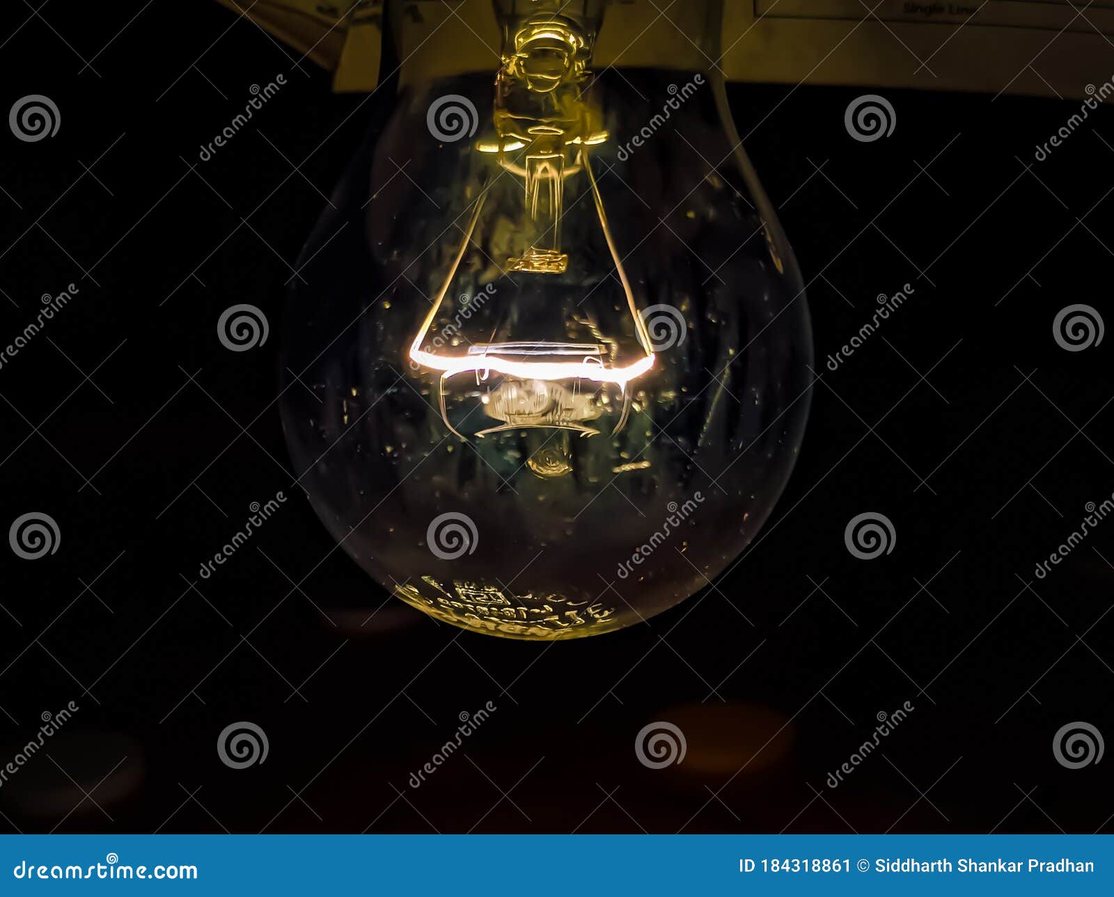 Light Bulb in the shadows stock image. Image of iron - 184318861