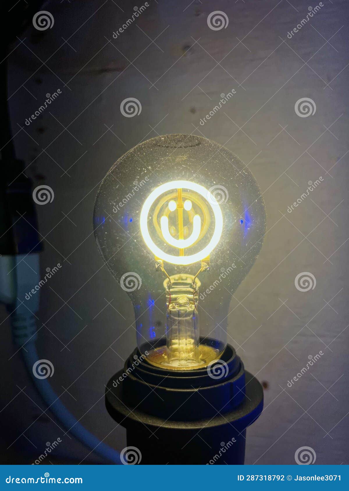 Light Bulb with a Smiley Face Stock Photo - Image of bulb, lighting ...