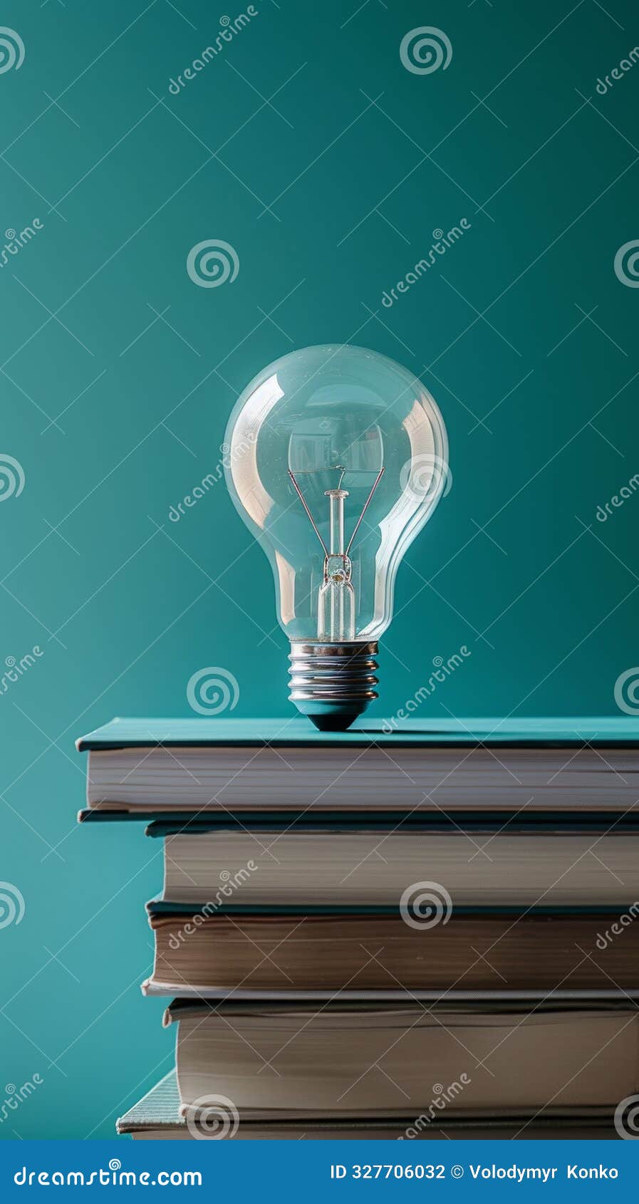 Light Bulb on a Stack of Books with Teal Background Stock Photo - Image ...
