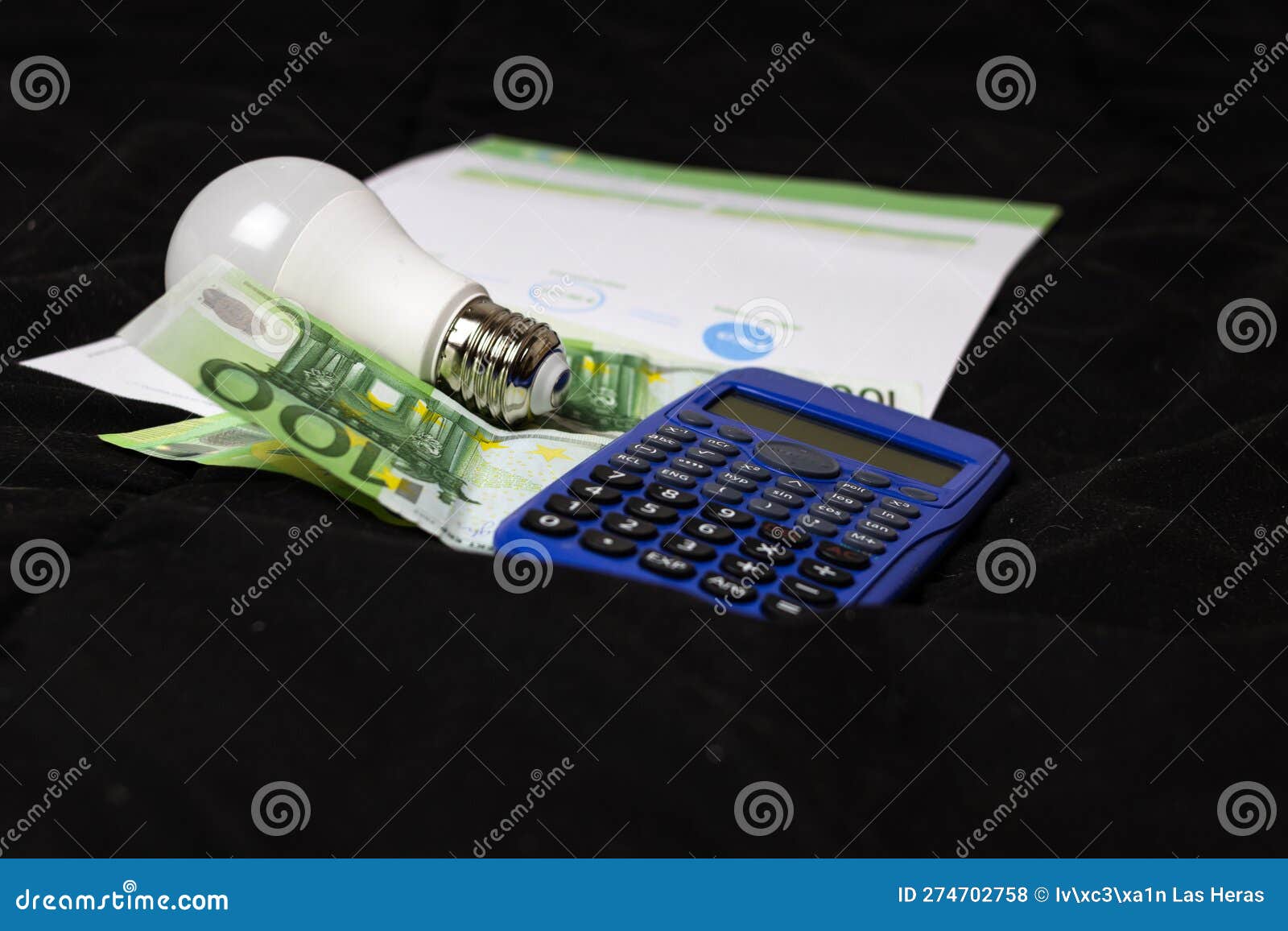 Light Bulb on a Stack of Cash, Symbolizing a Bright Financial Idea ...