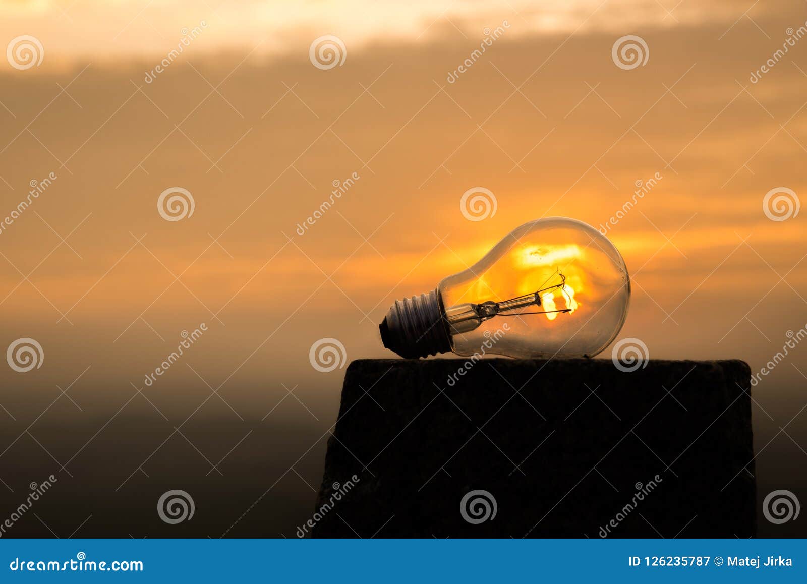Light bulb during sunset. stock image. Image of earth - 126235787
