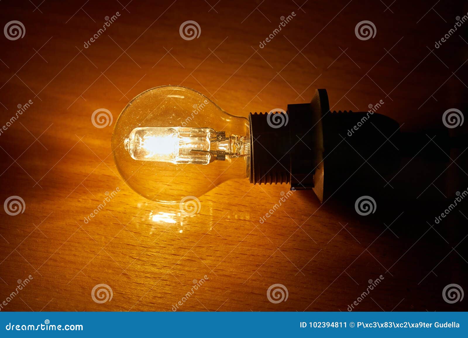 Light bulb on a table stock image. Image of energy, lamp - 102394811