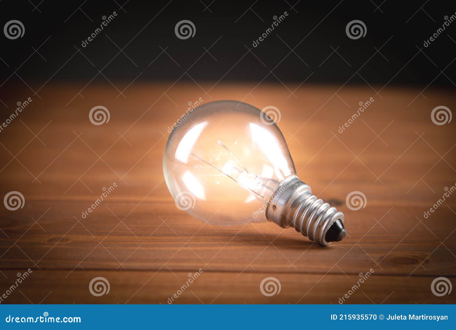 Light Bulb on the Table New Ideas Stock Photo - Image of design ...