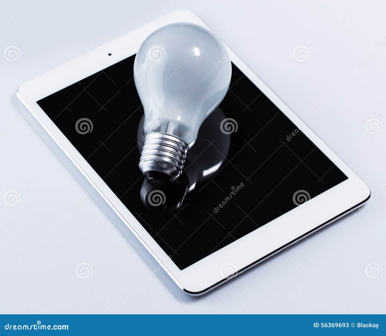 Light bulb and tablet pc stock image. Image of office - 56369693