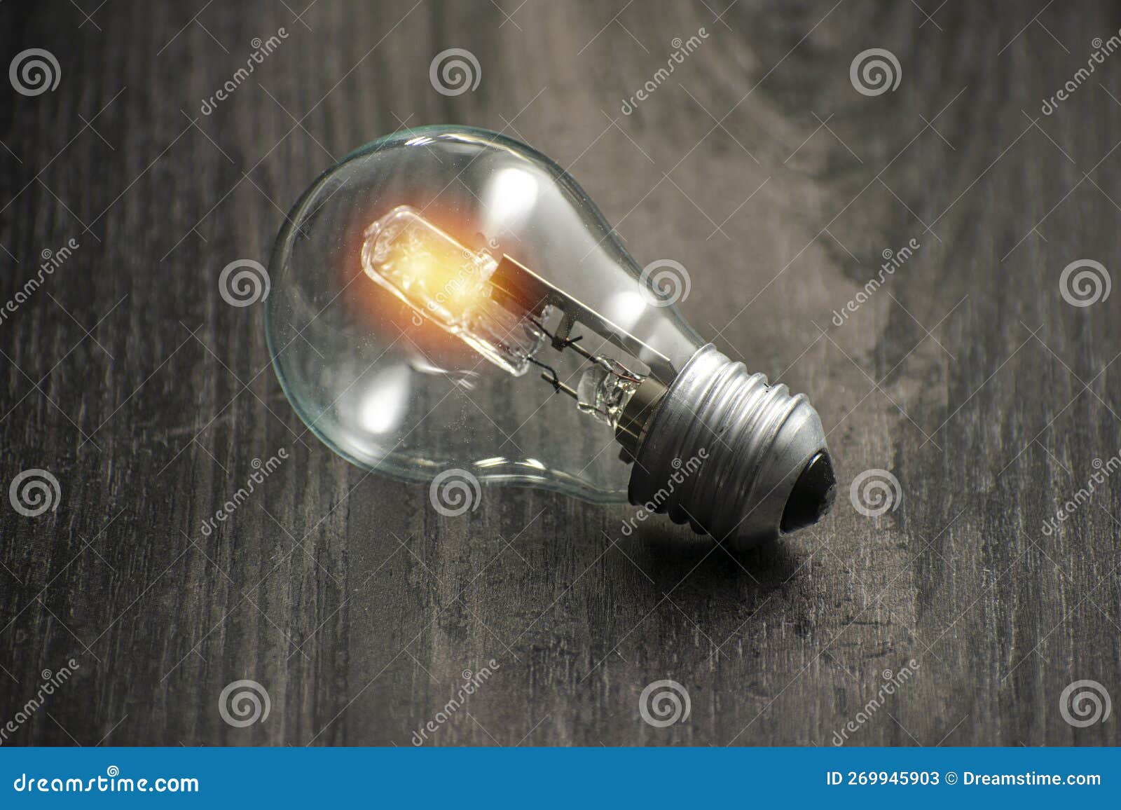 Light bulb on wooden table stock image. Image of plug - 269945903