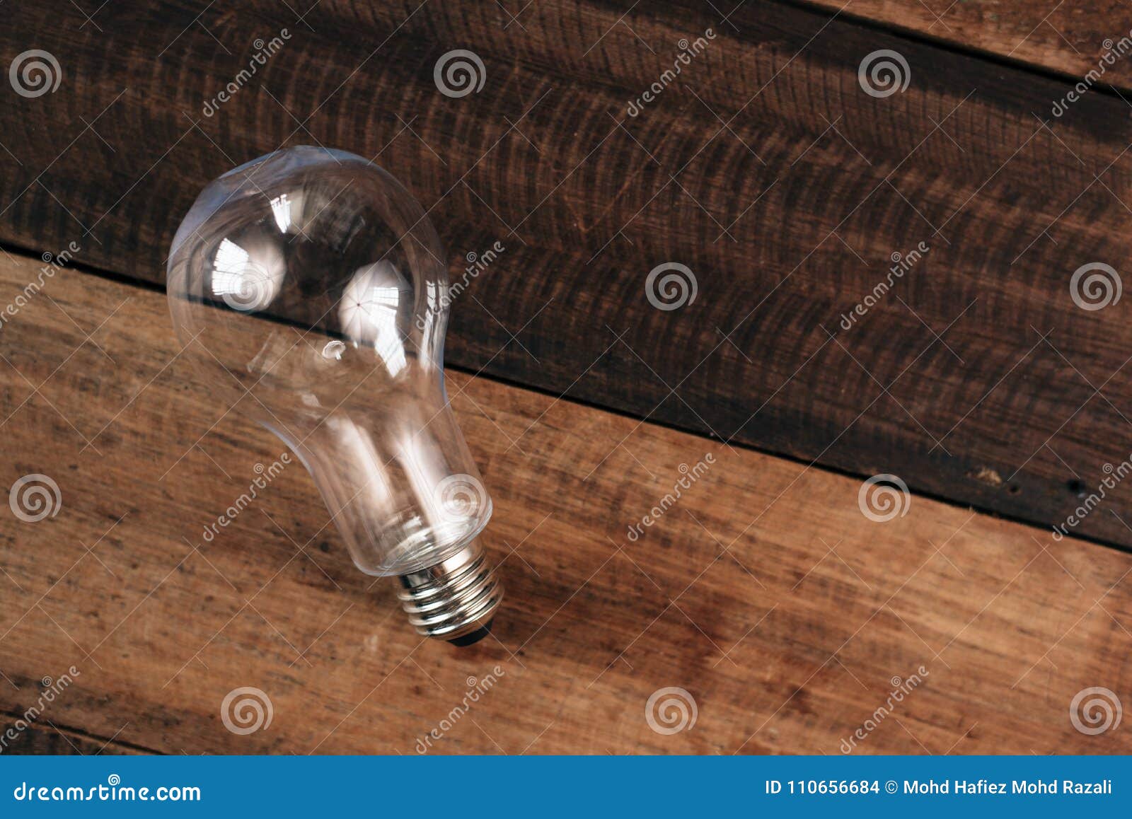 Light Bulb on a Wooden Table Stock Photo - Image of electricity ...