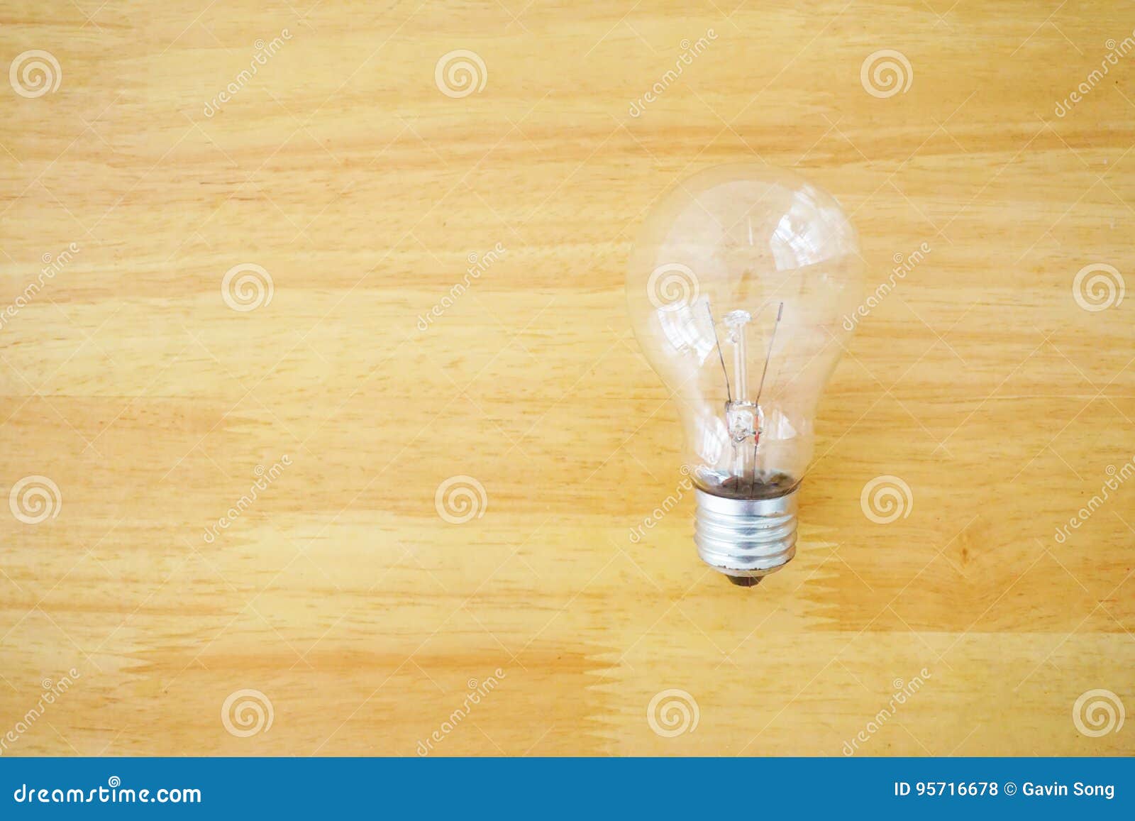 A Light Bulb on the Wooden Texture Background Stock Photo - Image of ...