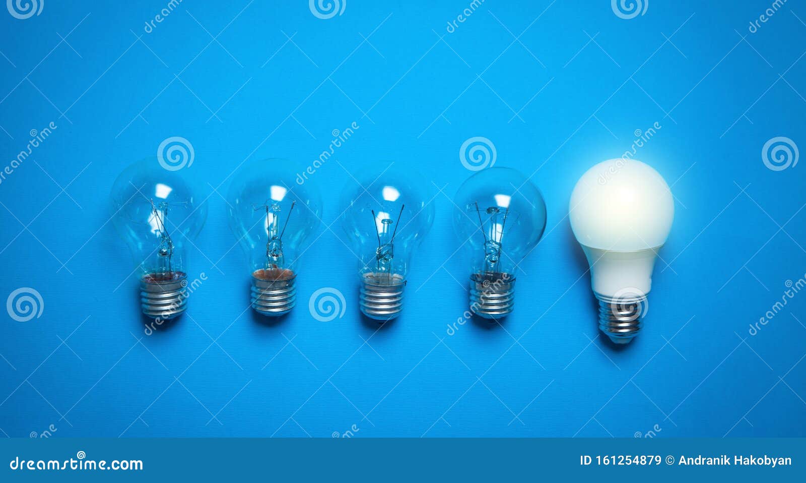 Light Bulbs in the Blue Background Stock Image - Image of illuminated ...