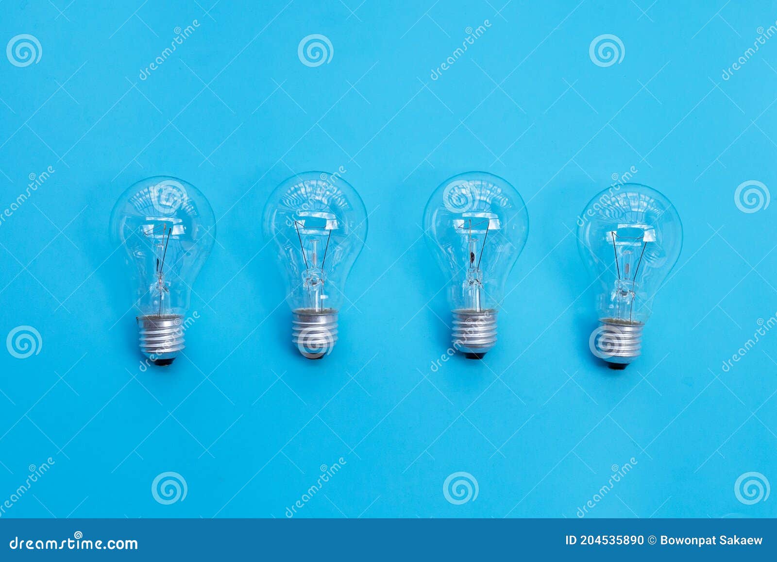 Light Bulbs on Blue Background. Ideas and Creative Thinking Concept ...