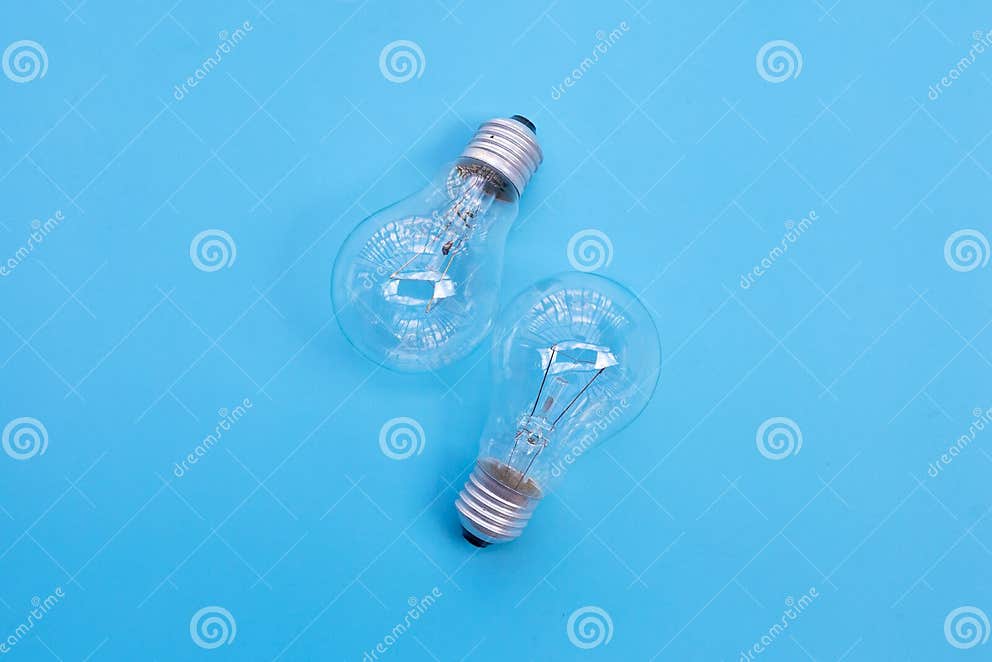 Light Bulbs on Blue Background. Ideas and Creative Thinking Concept ...