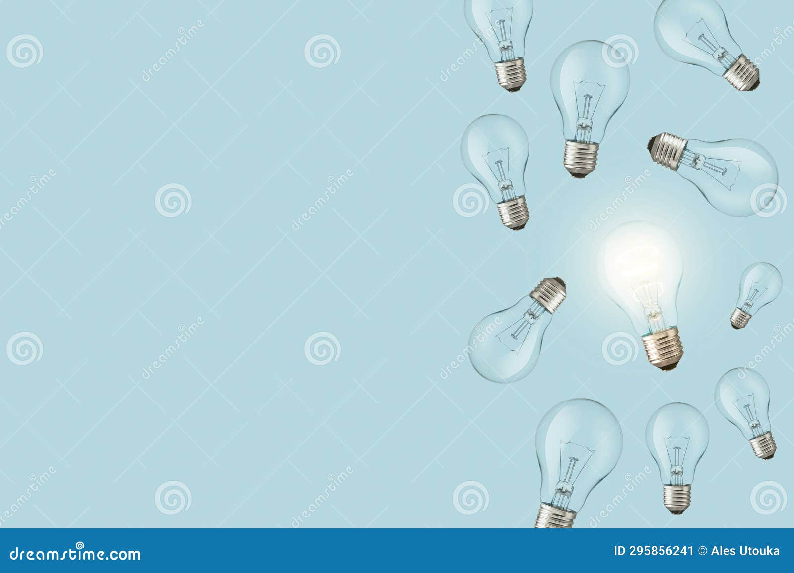 Light Bulbs on a Blue Background and One Creative Glowing Light Bulb ...