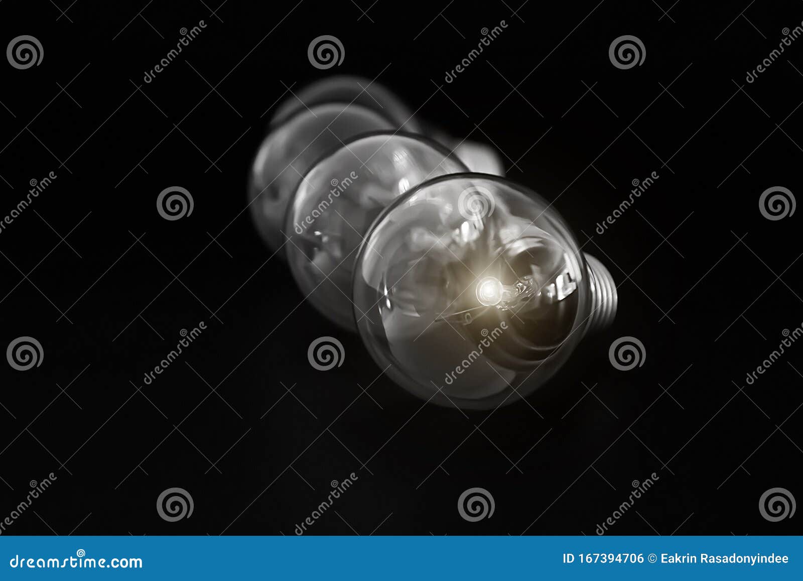 Light Bulbs with Bright Light Concept with Dark Background Stock Photo ...