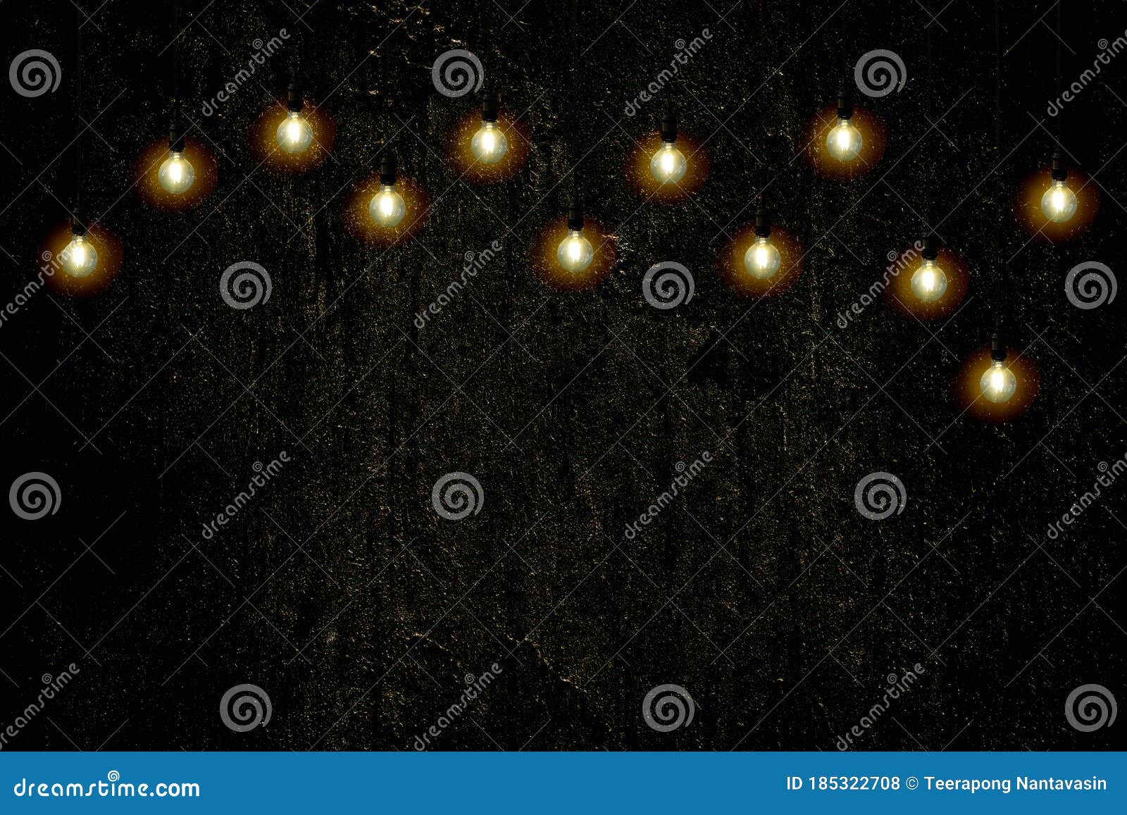 Light Bulbs in the Dark Concrete Wall Texture Background. Stock Photo ...