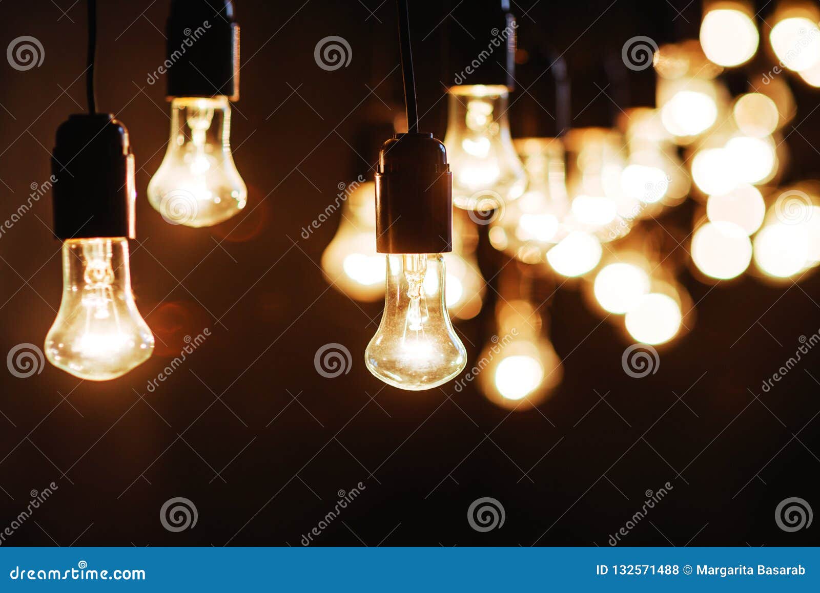 Light Bulbs Over Dark Texture Stock Photo - Image of globe, bulb: 132571488