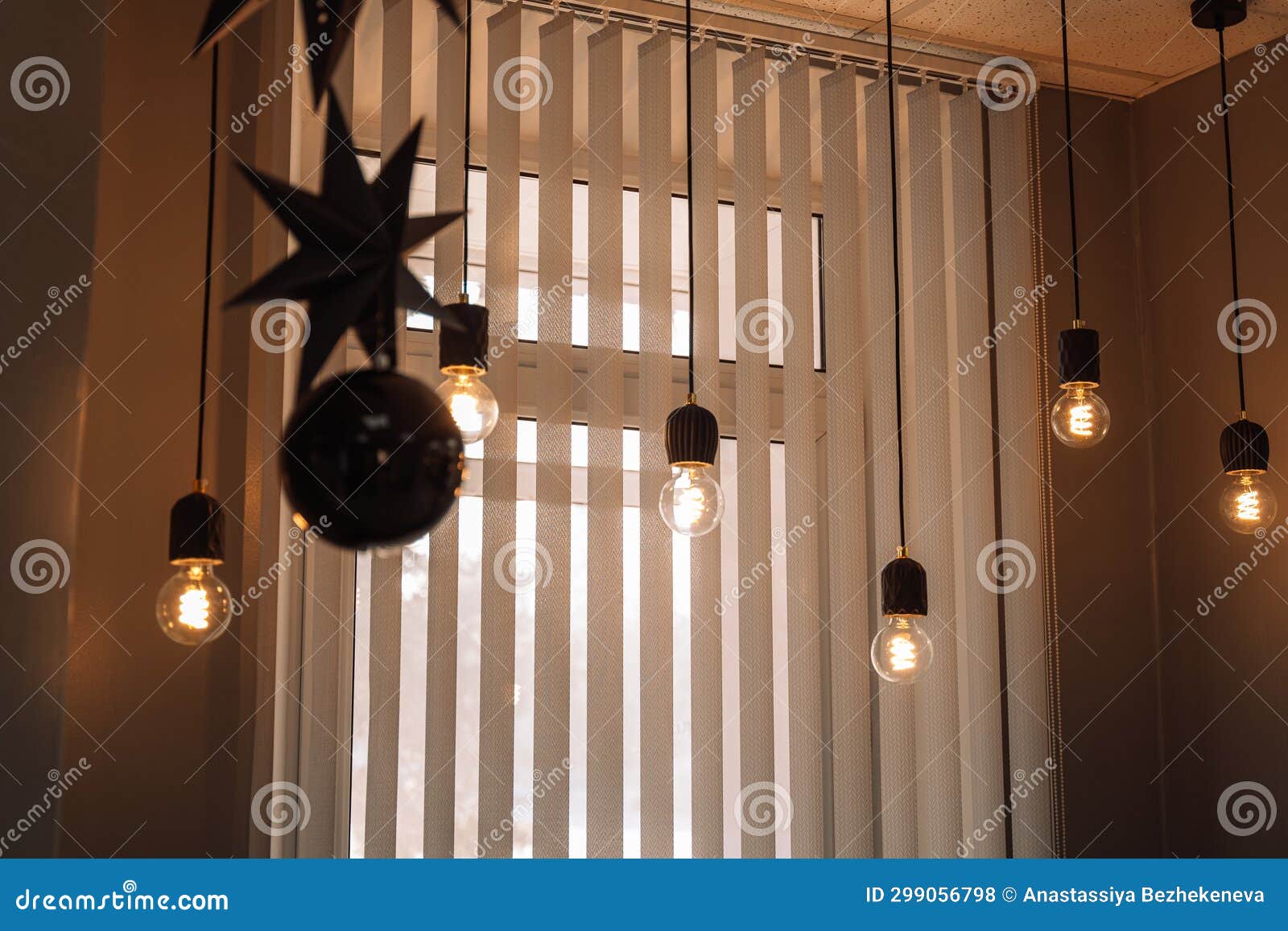 Light Bulbs on Wires and Christmas Tree Decorations Hang from the ...