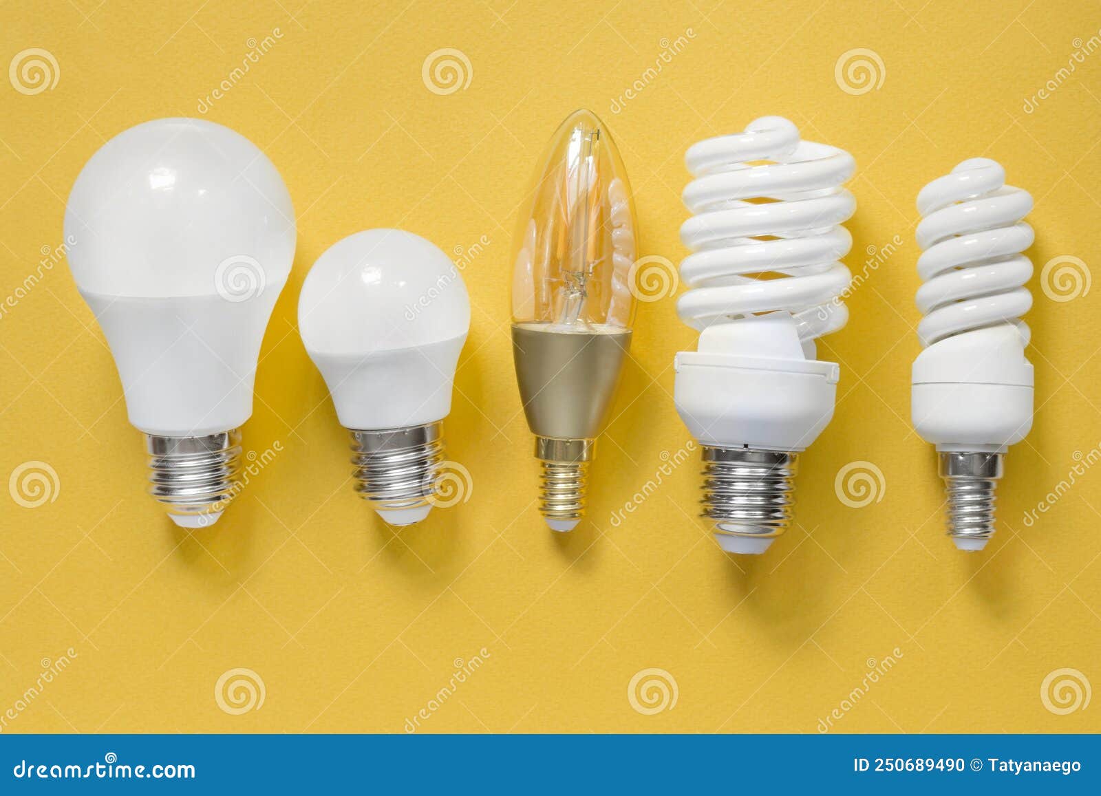 Light bulbs on yellow stock photo. Image of lighting - 250689490