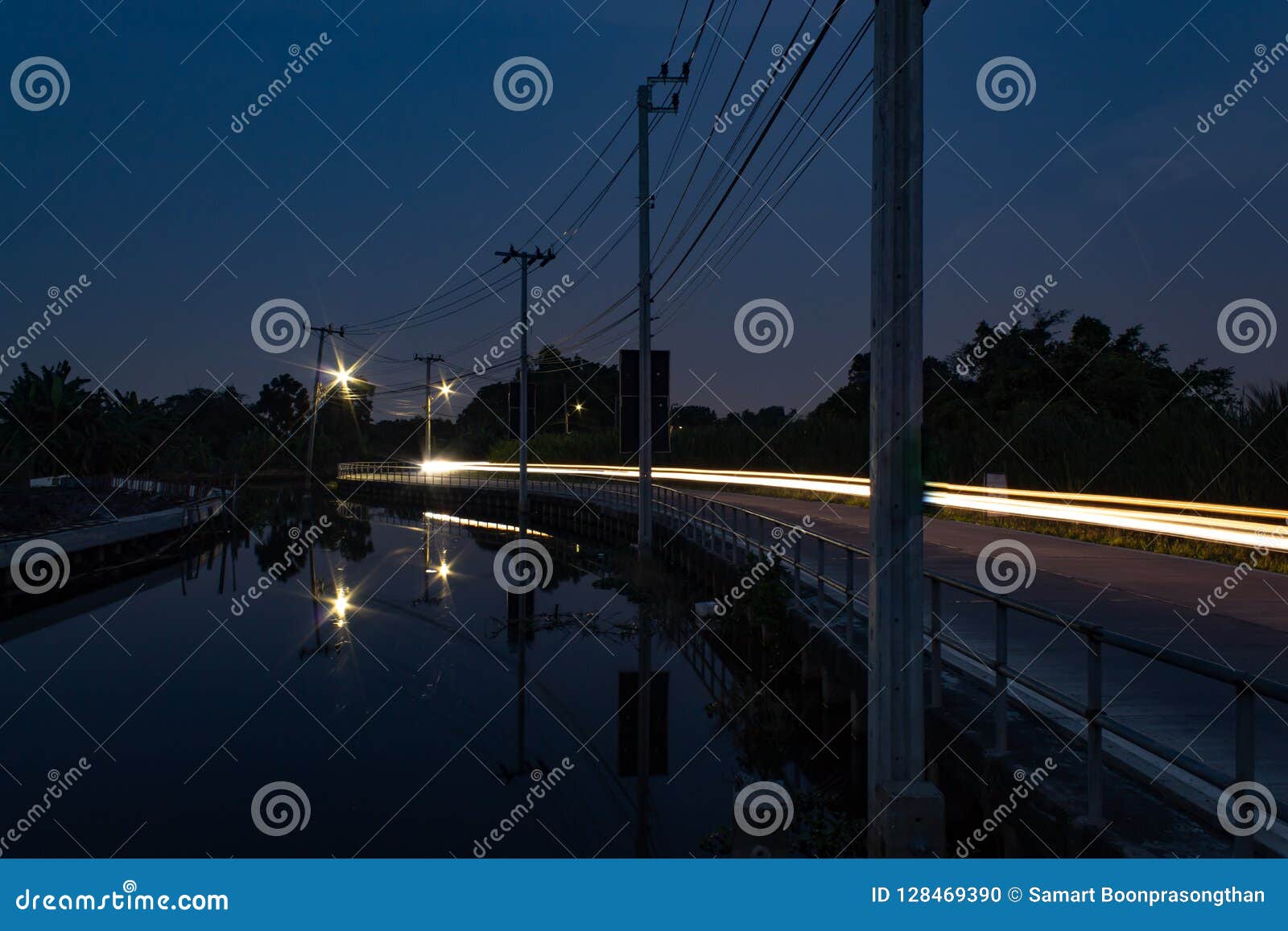 The Light from the Car and Roadside Lamp Reflecting Surface. Stock ...