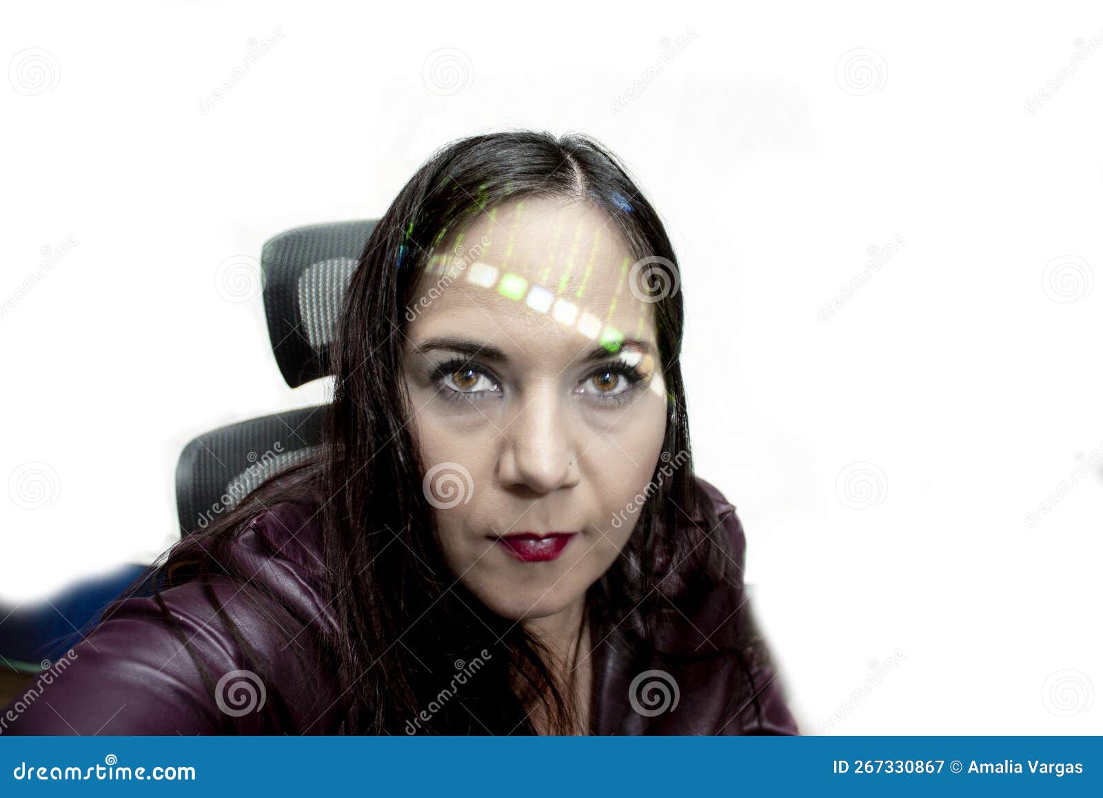 Light Code Projected Onto the Forehead of a Woman Programmer while she ...