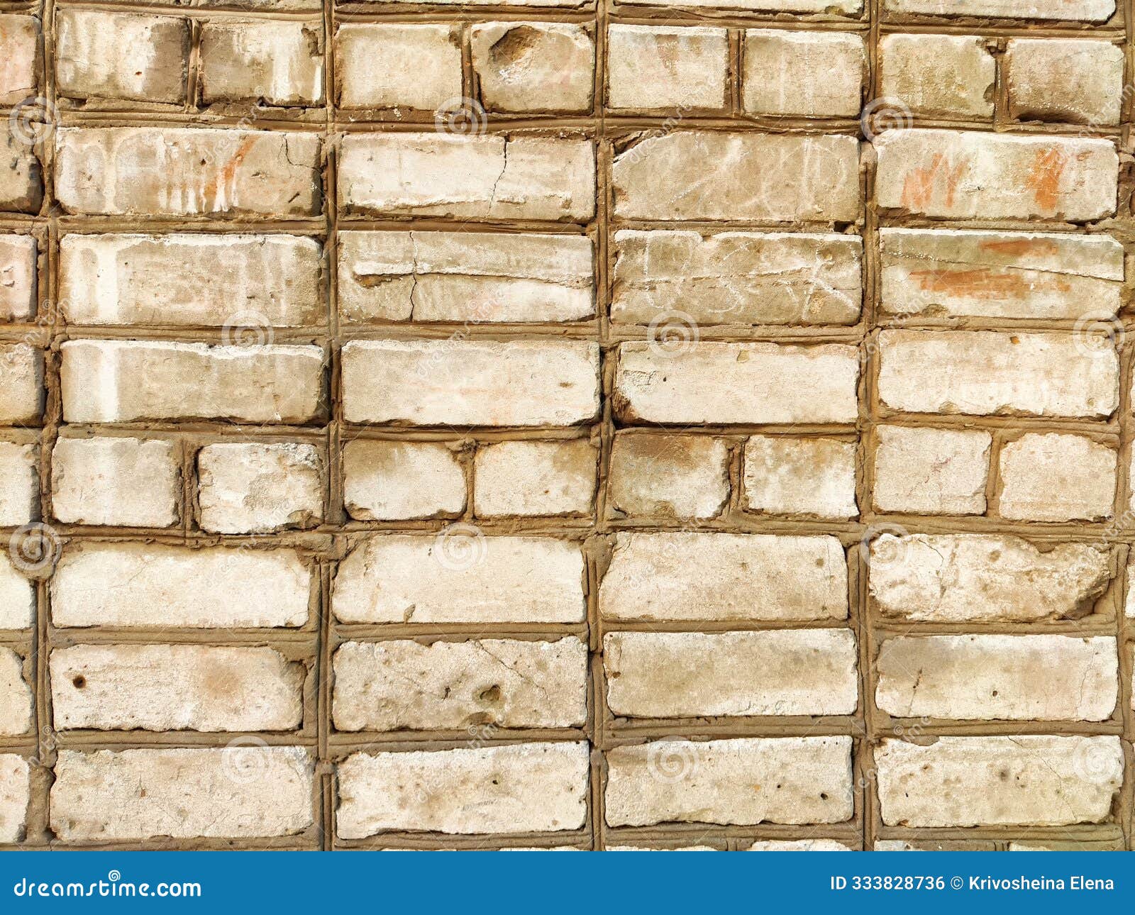 A Light-colored Brick Wall Displays Unique Textures and Patterns ...