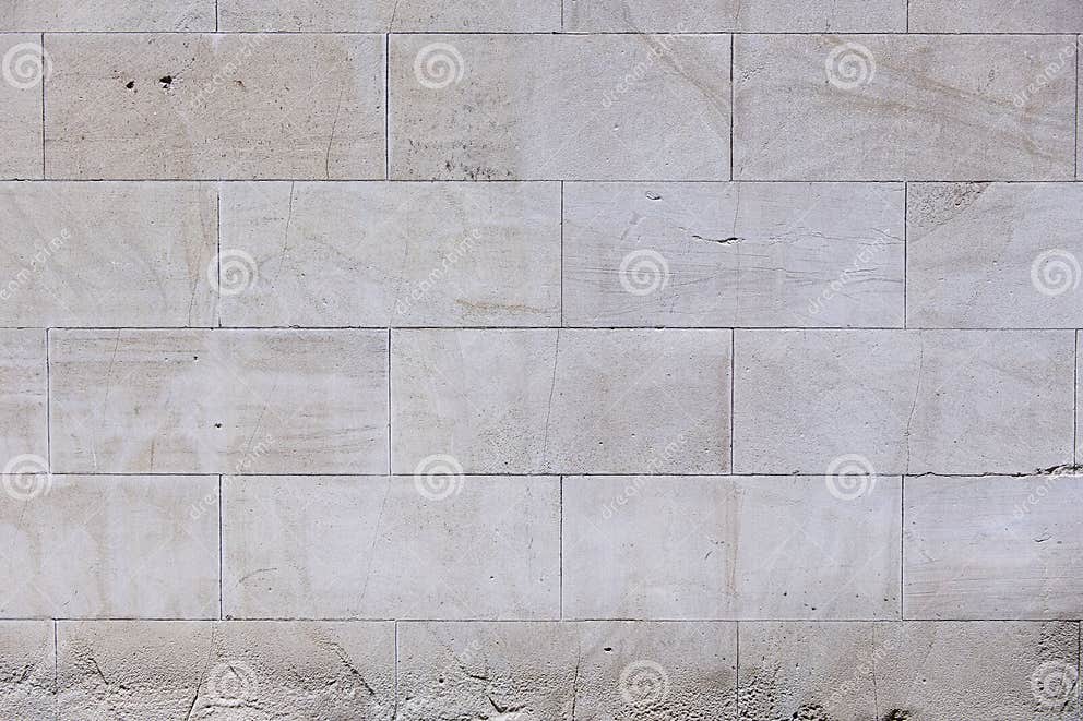 A Light Colored Stone Wall with Moisture Marks at the Bottom Stock ...