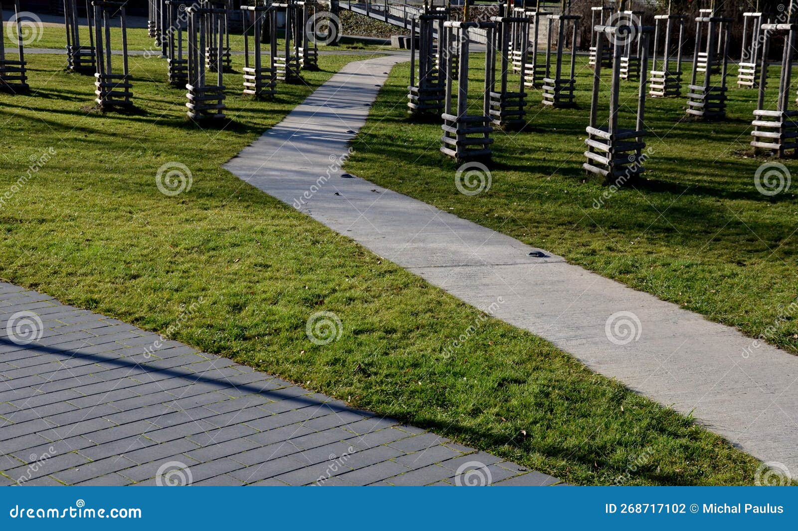 Light Concrete Path through the Park. the Crooked Line of the Path in ...