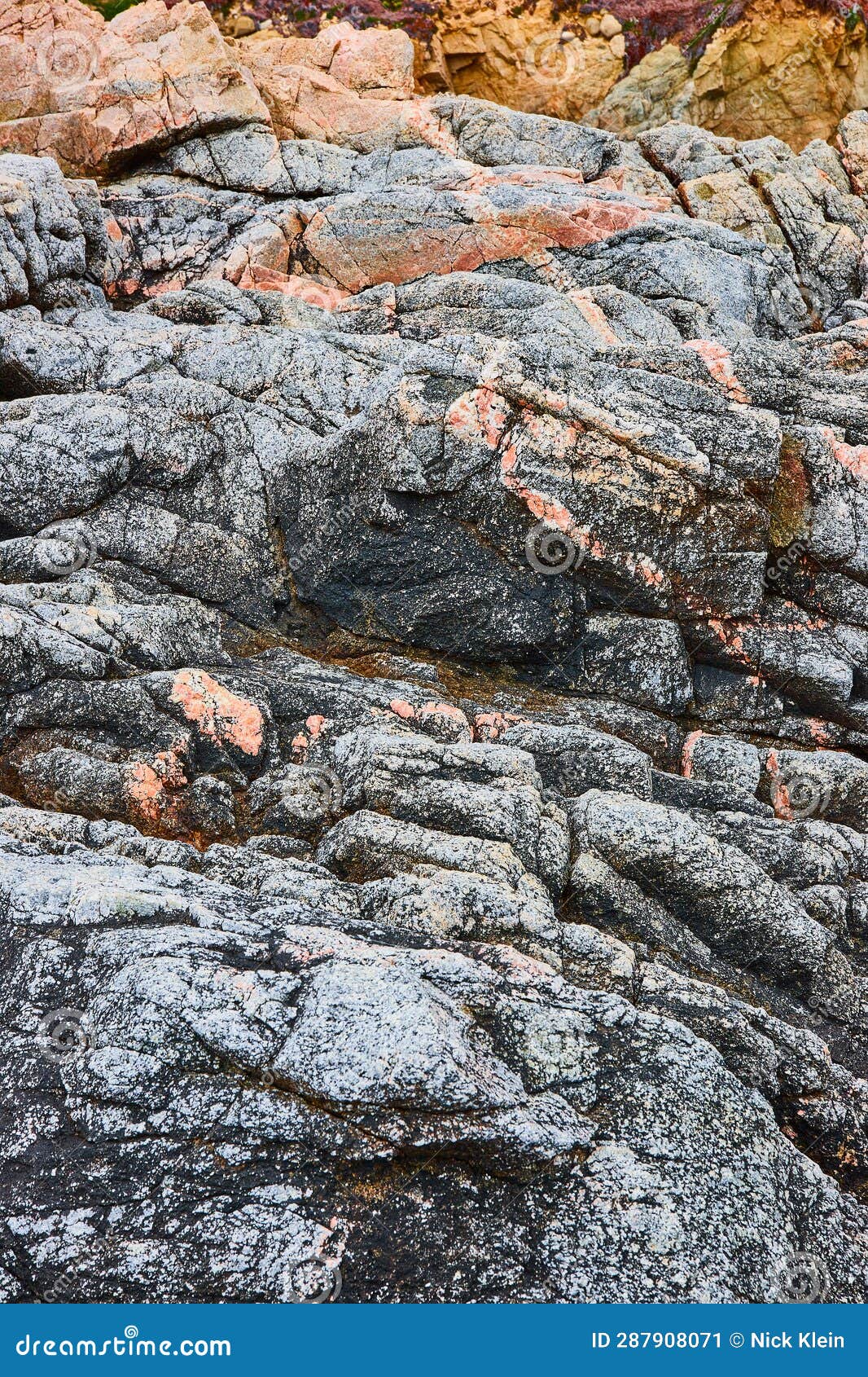 Light and Dark Gray Stony Cliff Wall with Tan Rock and Cracks in Stone ...