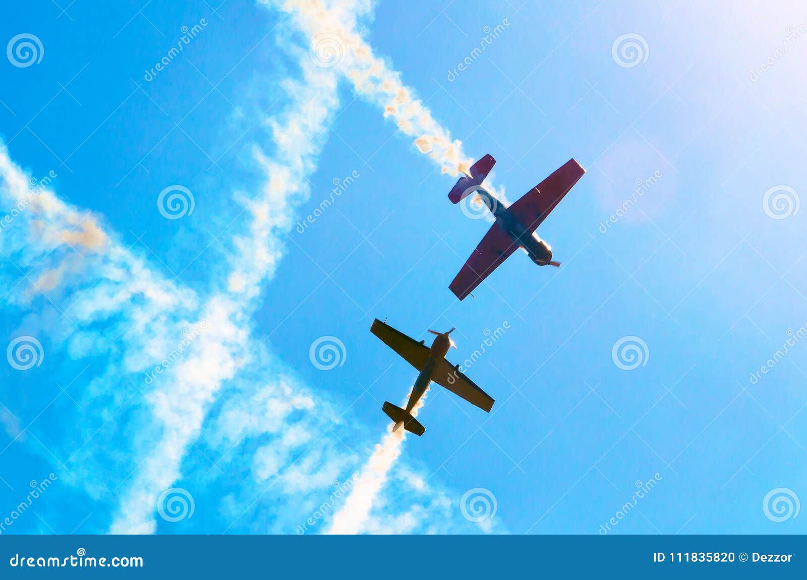 Light Engine Airplane with a Trace of White Smoke Fly in Groups in the ...