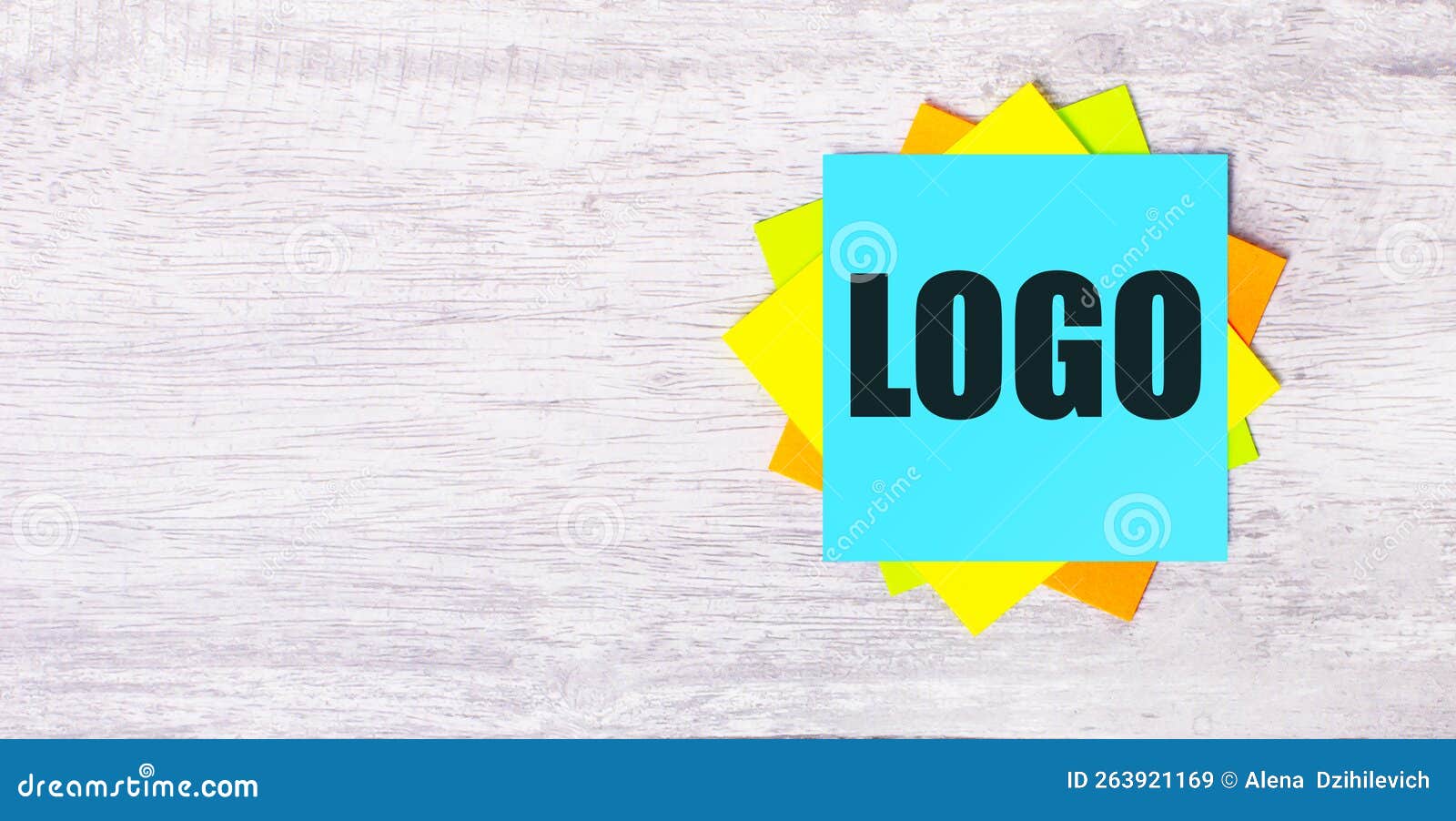 On a Light Gray Wooden Background, Bright Stickers with the Text LOGO ...