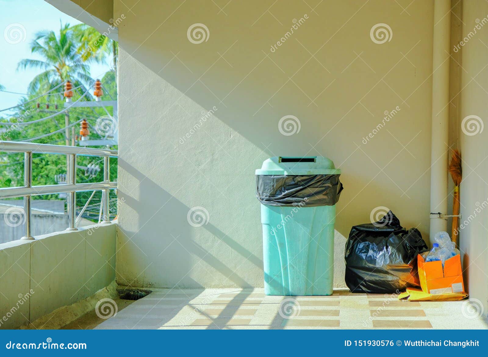 Light Green Garbage Bin on the Walkway in the Building Stock Photo ...