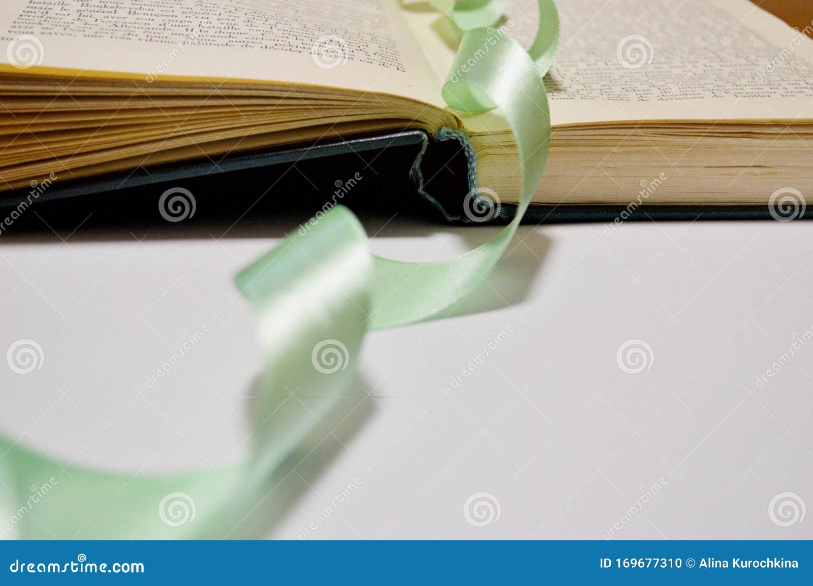 Light Green Ribbon Bookmark in a Book Stock Photo - Image of invitation ...