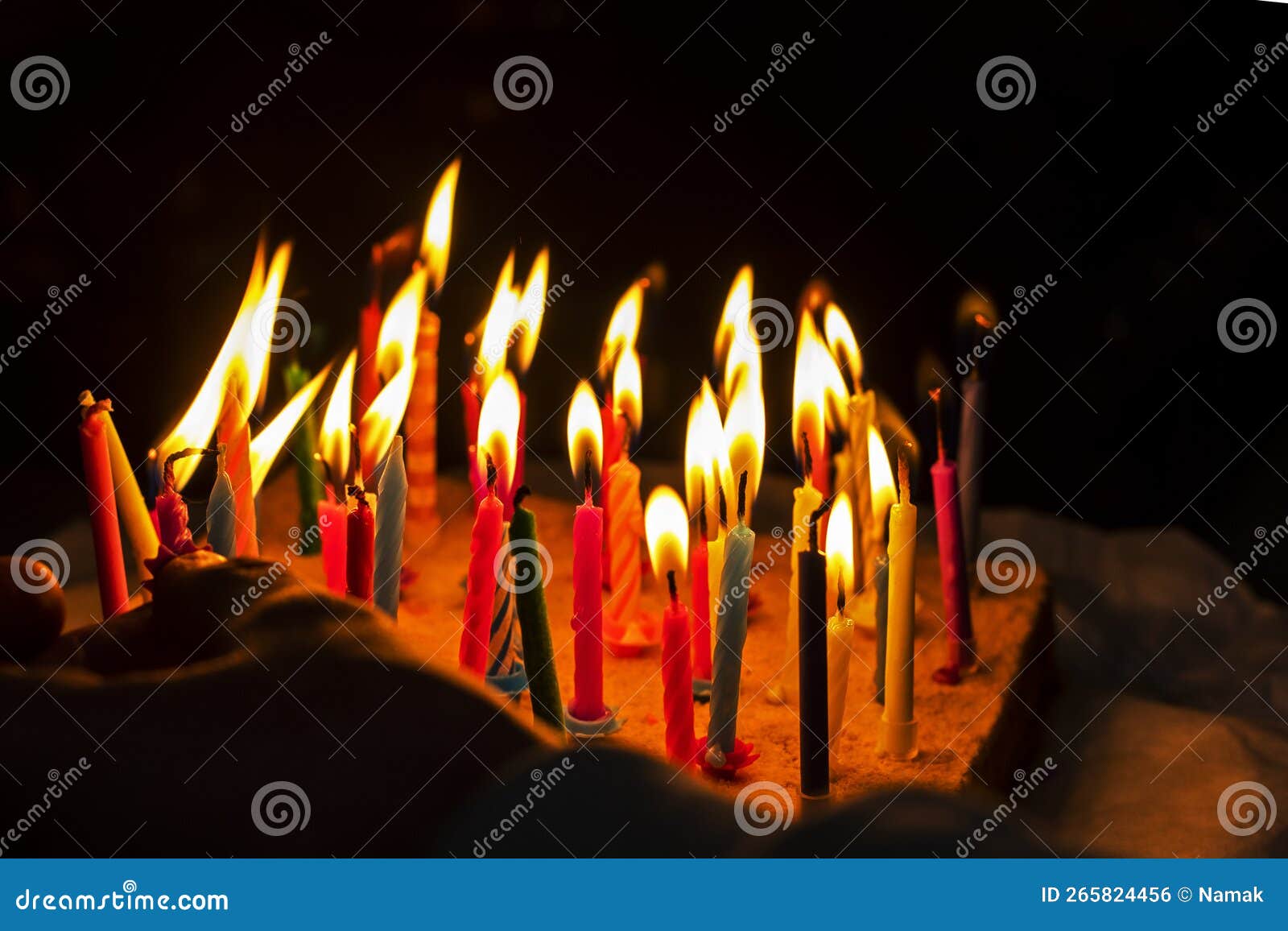 Light a Lot of Multi-colored Candles on a Festive Anniversary Cake in ...