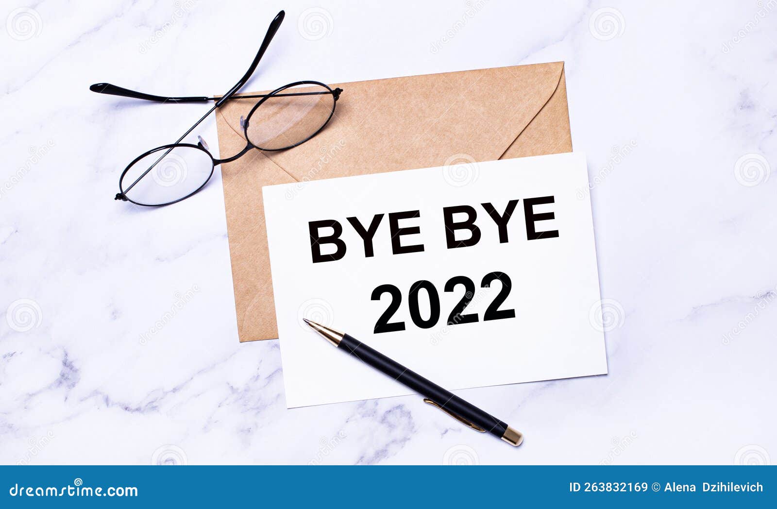 On a Light Marble Background, a Craft Envelope, Glasses, a Pen and a ...