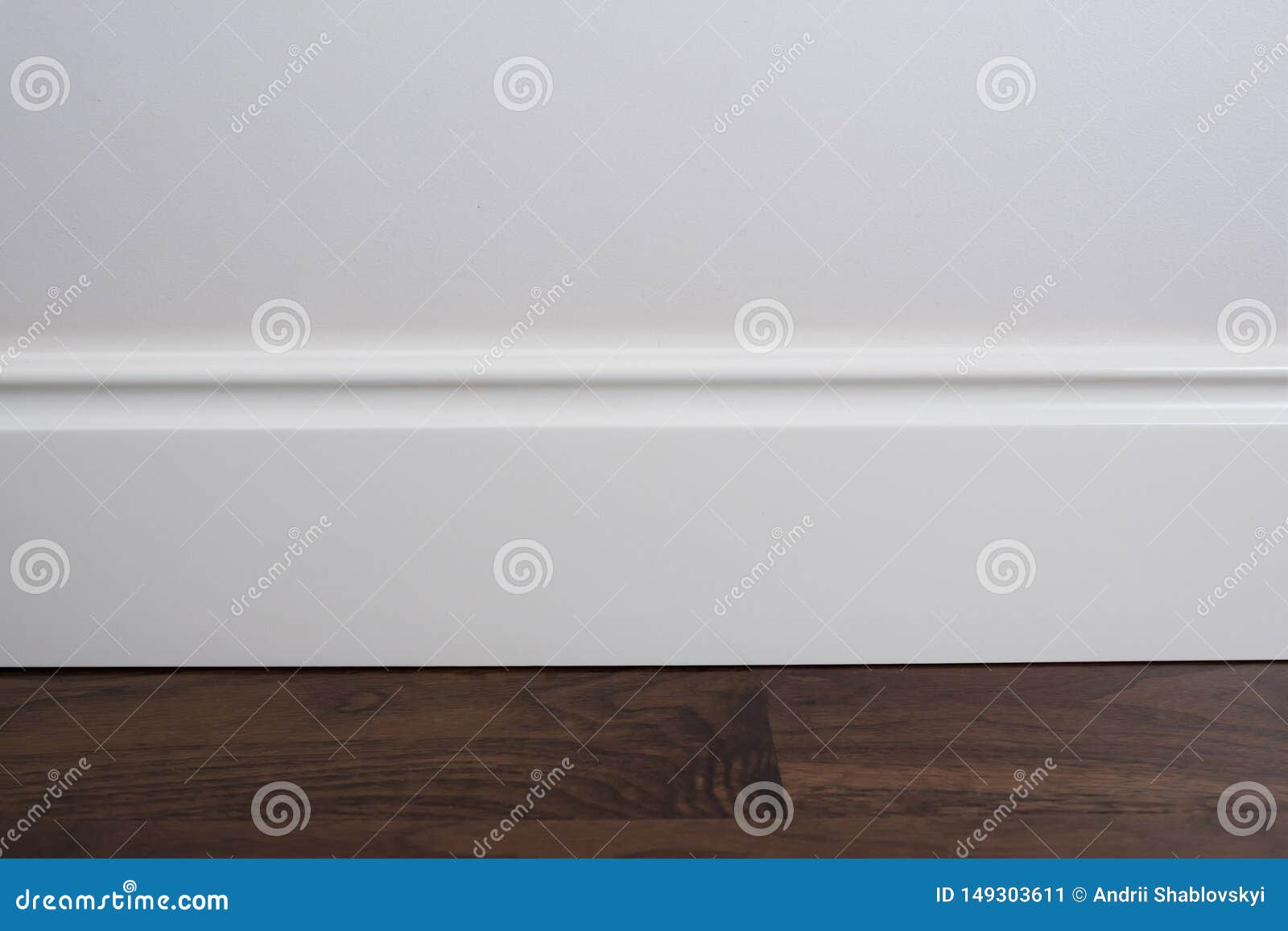 Light Matte Wall, White Baseboard and Tiles Immitating Hardwood ...