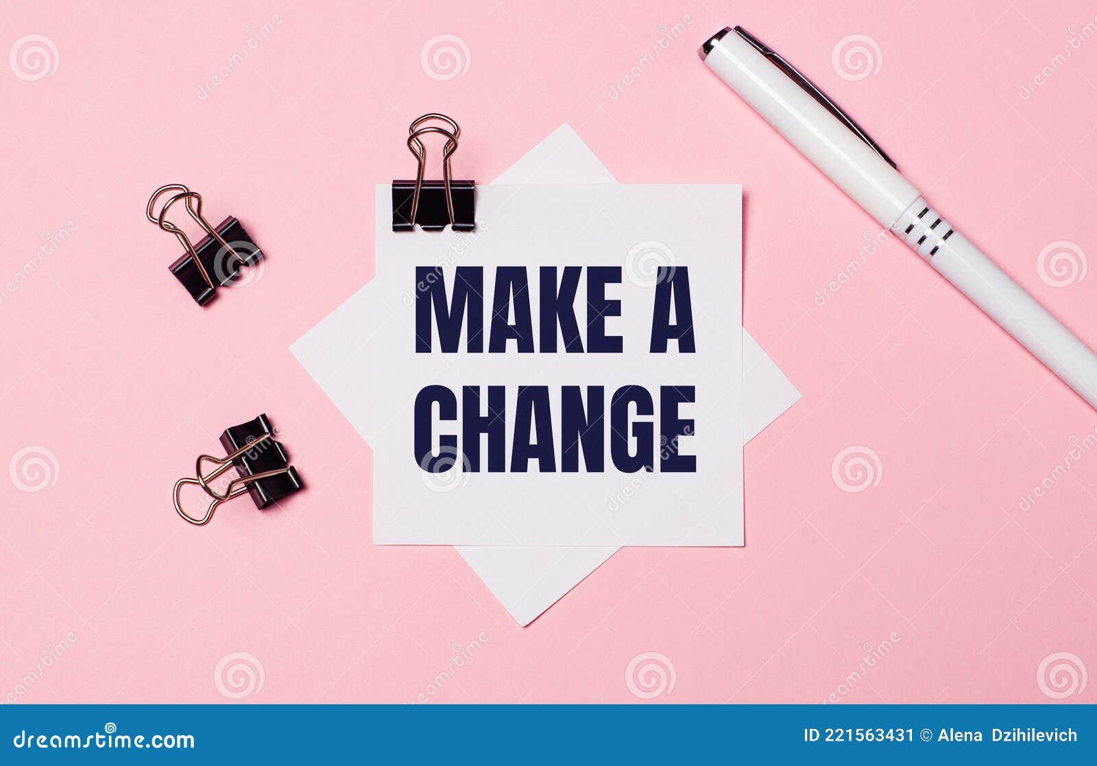 On a Light Pink Background, Black Paper Clips, a White Pen and White ...