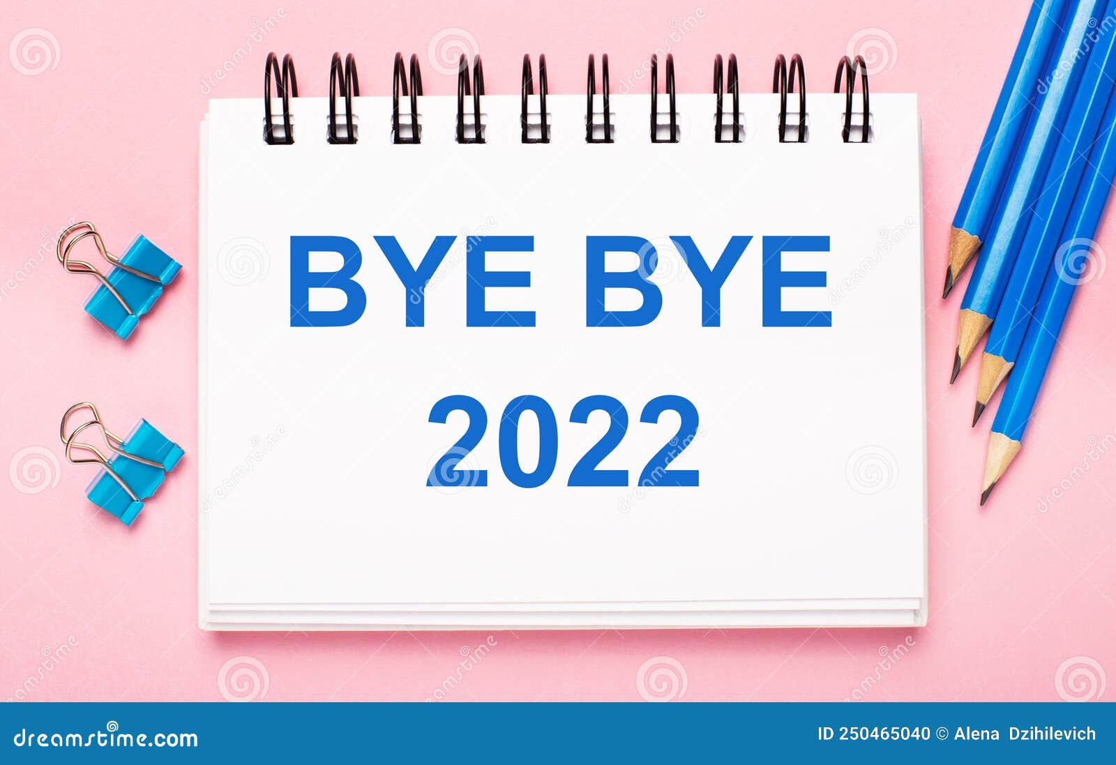 On a Light Pink Background, Light Blue Pencils, Paper Clips and a White ...