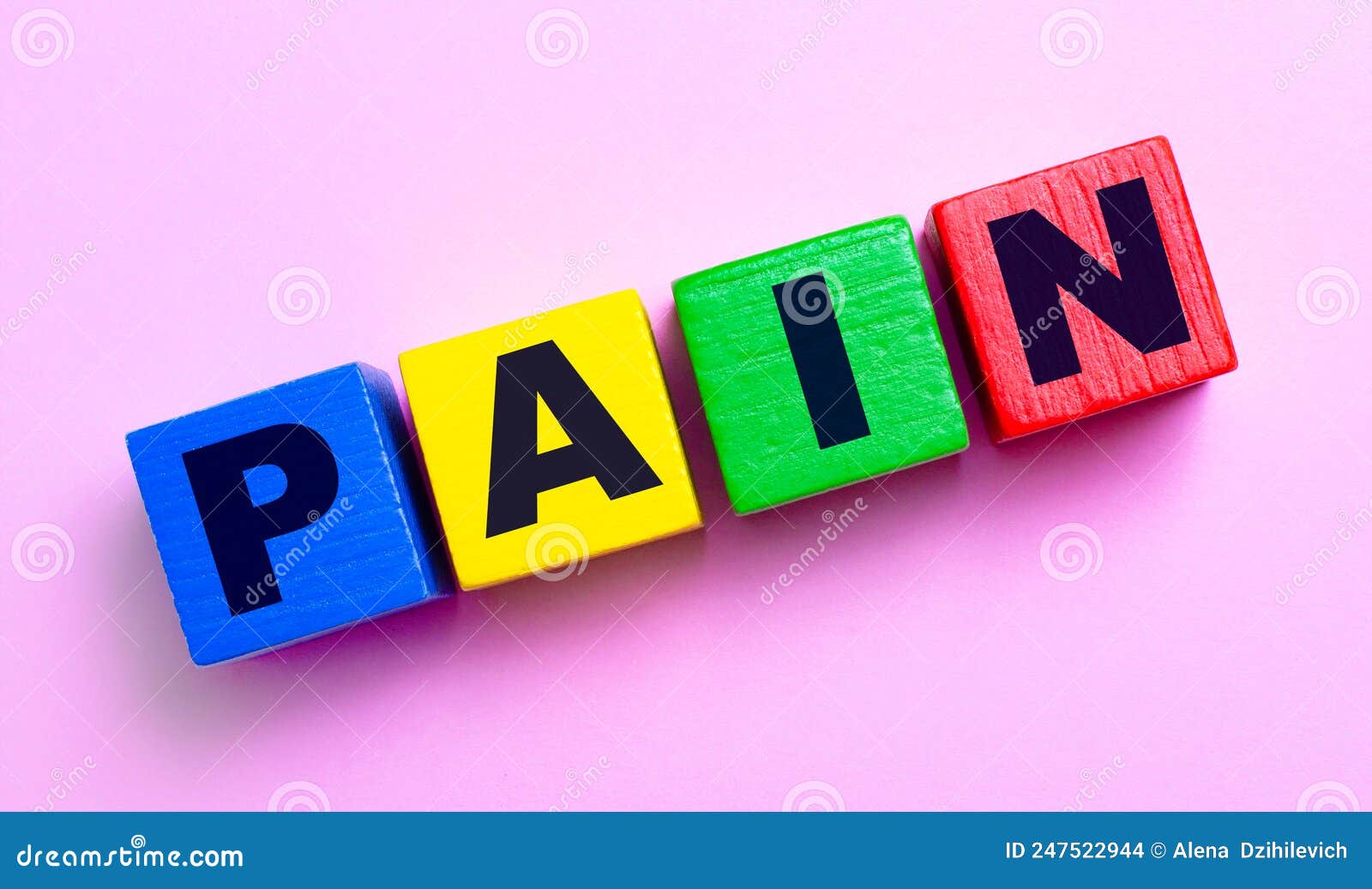 On a Light Pink Background, Multi-colored Wooden Cubes with the Text ...