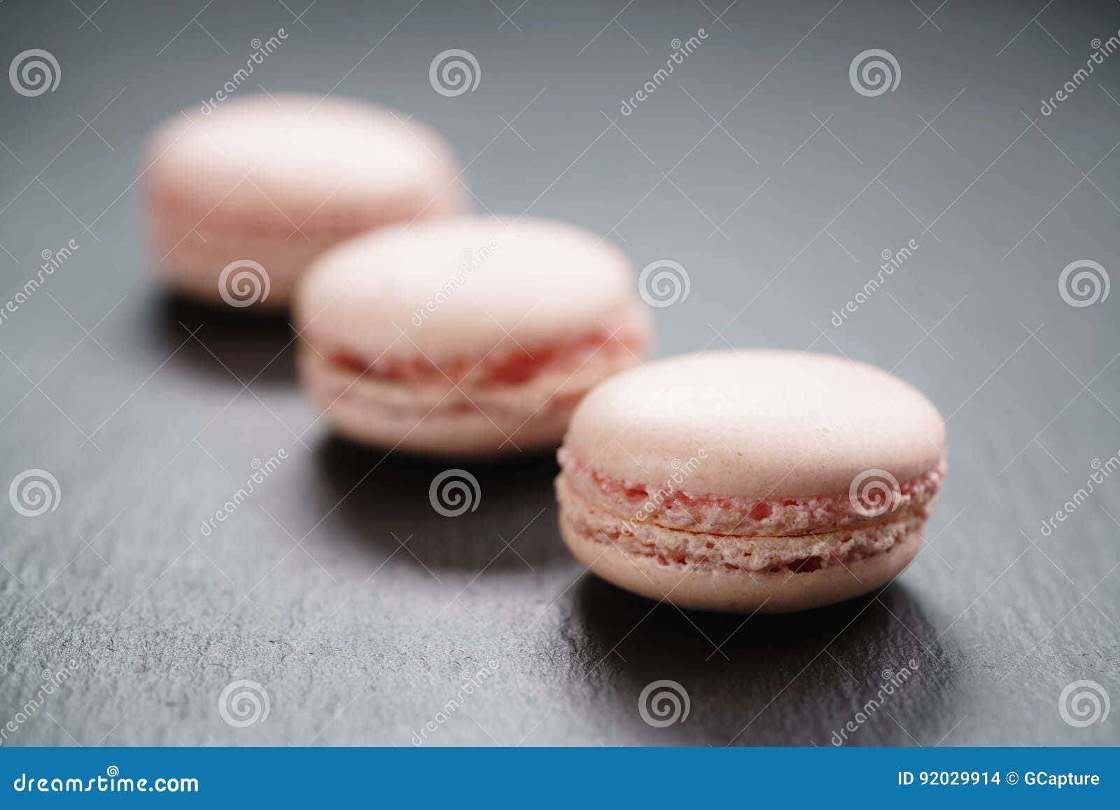 Light Pink Macarons on Slate Background Stock Photo - Image of ...