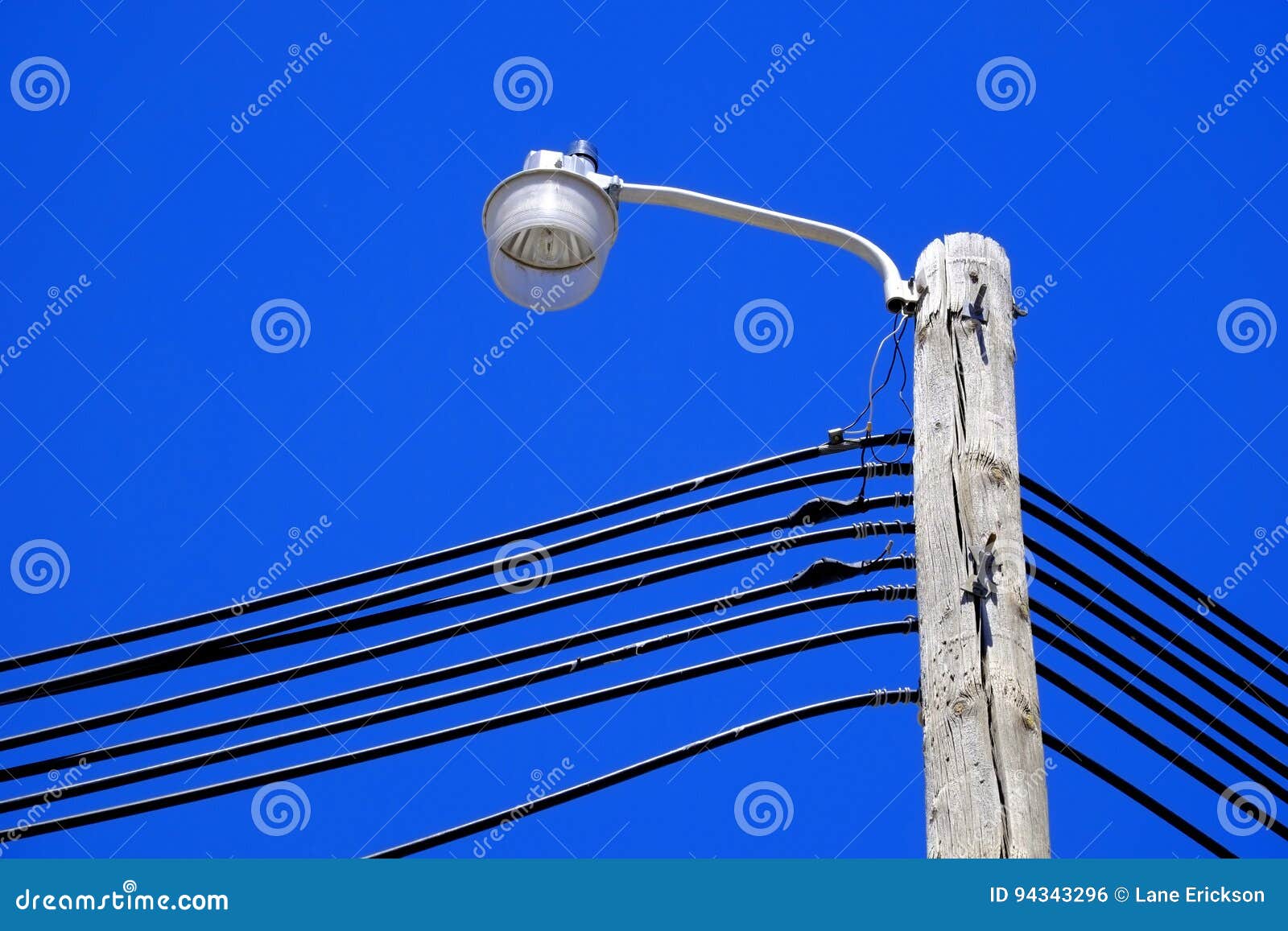 Light Pole with Power Lines and Blue Sky Stock Photo - Image of light ...