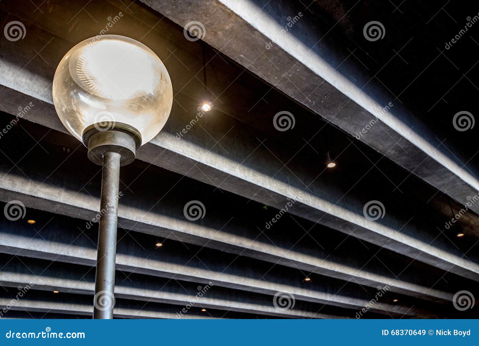 Light Post Under Concrete Beams Stock Image - Image of light, bridge ...