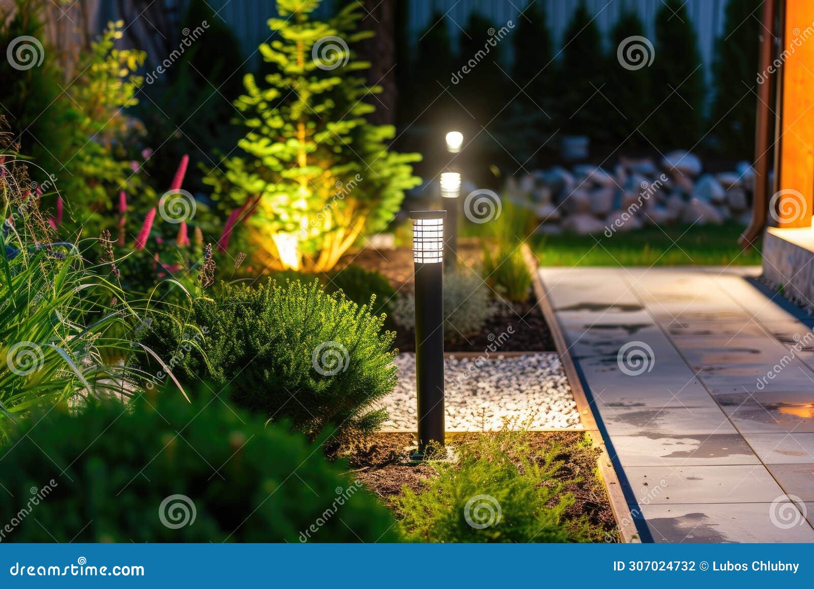 Light Posts Illuminated Backyard Garden during Night Hours. Modern ...