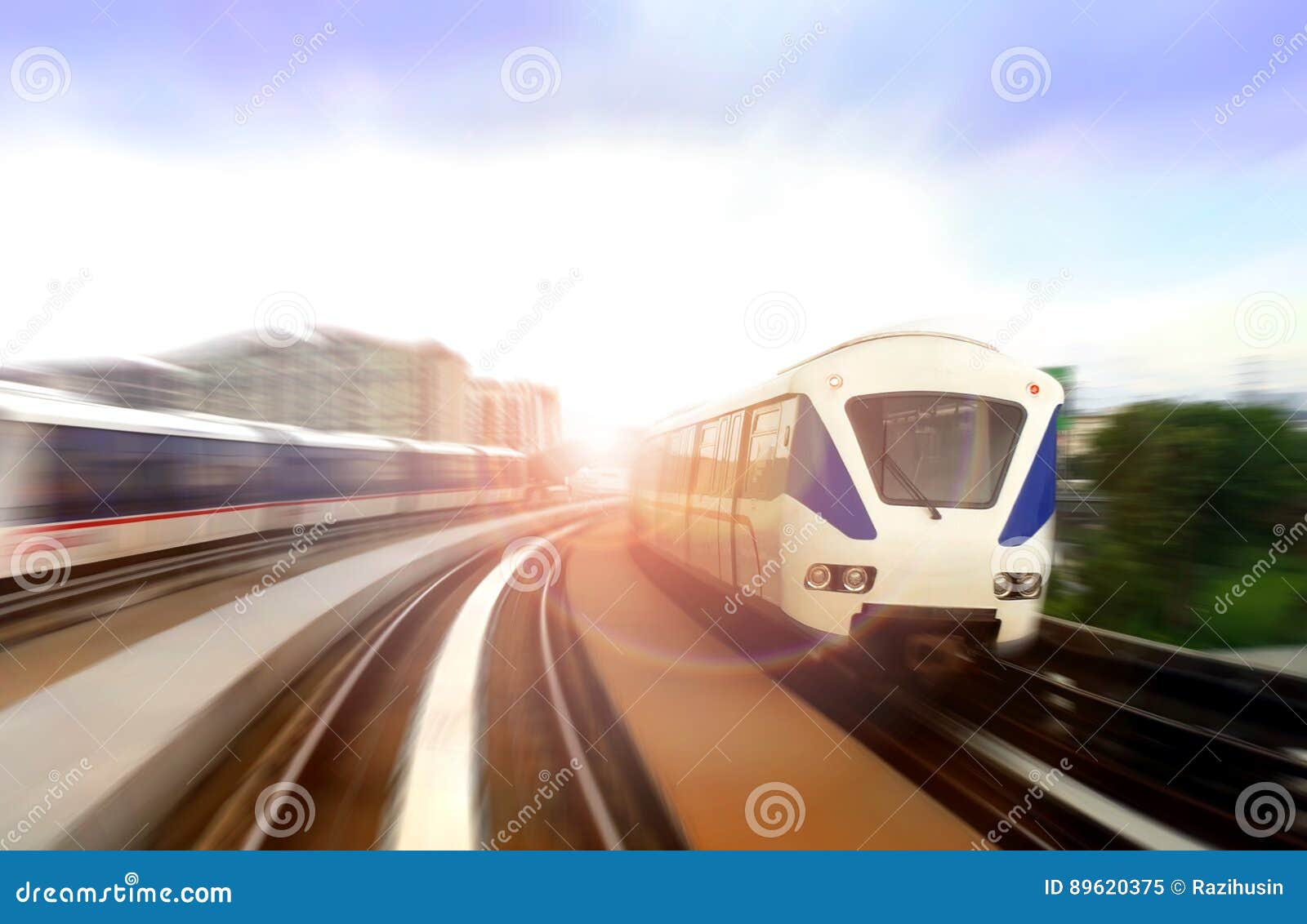 Light Rail Train on the Move with Bright Sunlight Glare Stock Image ...