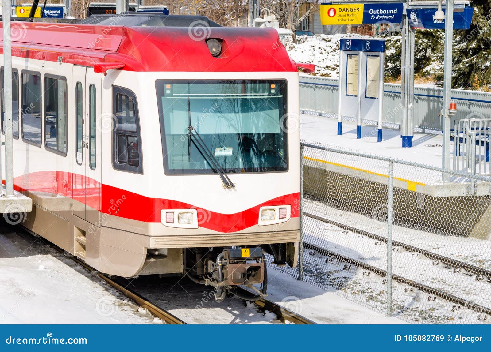 Light Rail Train Pulling Out of a Snowy Station Stock Image - Image of ...