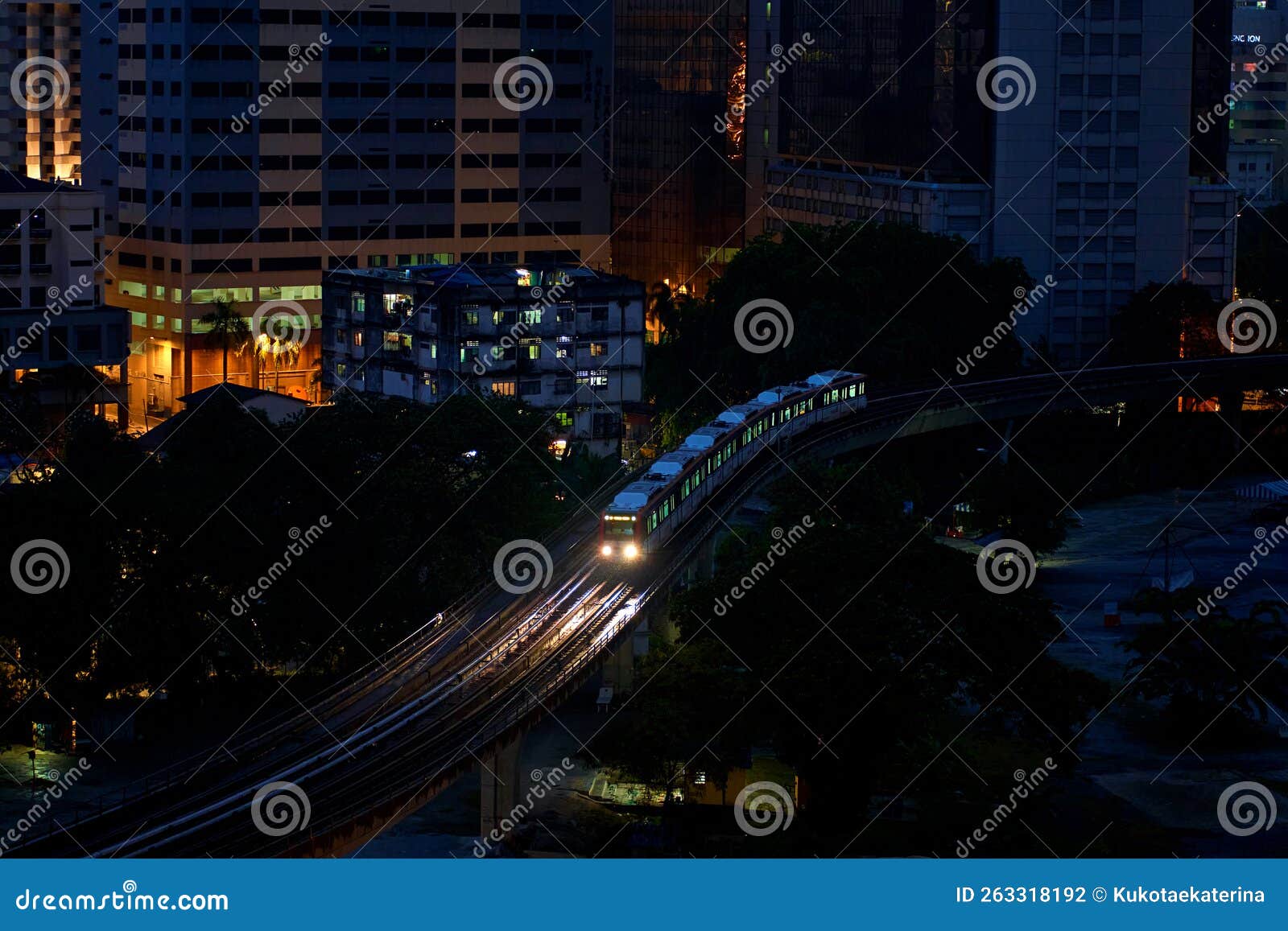 Light Rail Transit Train Moving through the City in the Night Stock ...