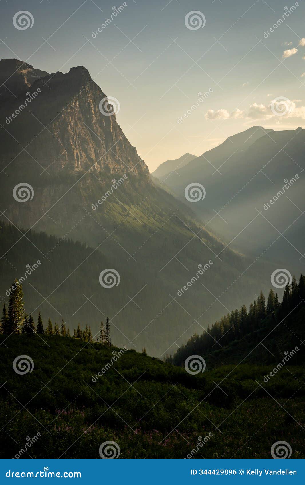Light Rays Shine on the Base of Mount Cannon in Glacier Stock Photo ...