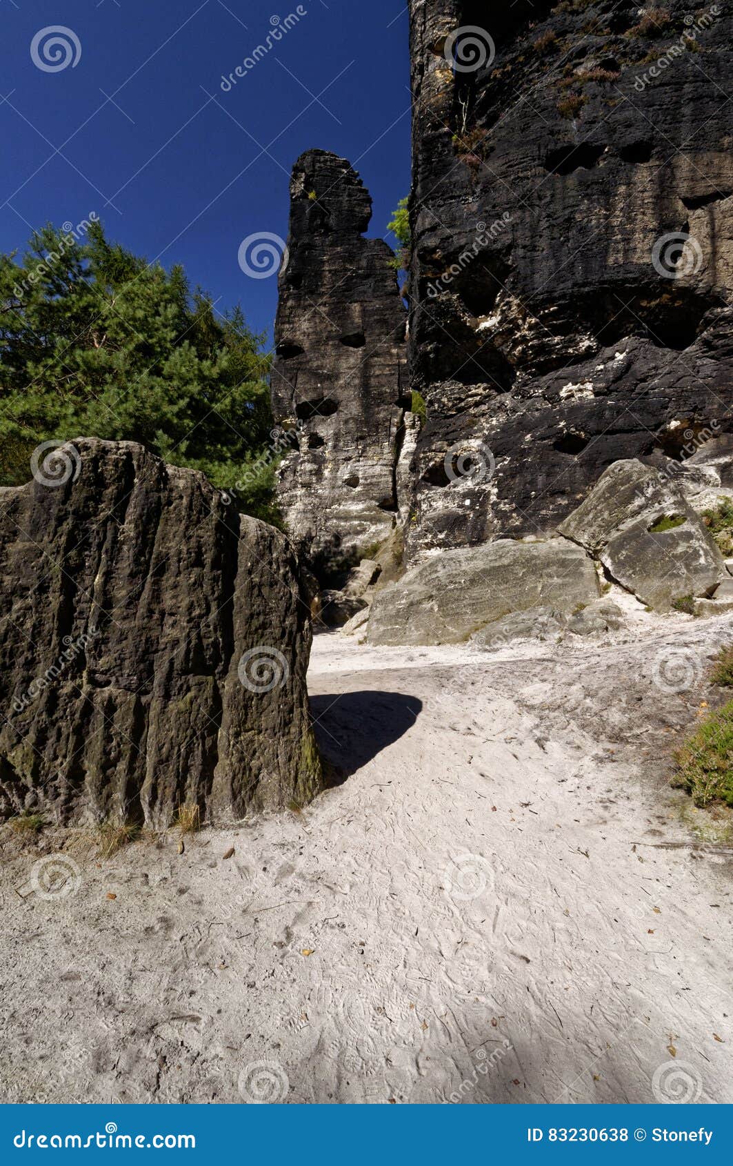 Light Sandy Ground with Tall Hard Rock Formations Rising from it Stock ...