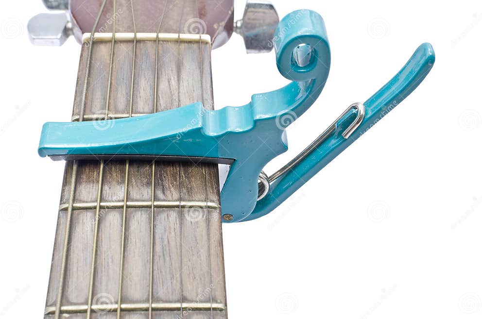 Light Sea Green String Capo with Guitar on White Background Stock Photo ...