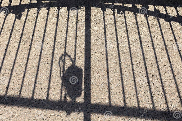 Light and Shadow. Shadow of Railing on the Pavement Stock Photo - Image ...