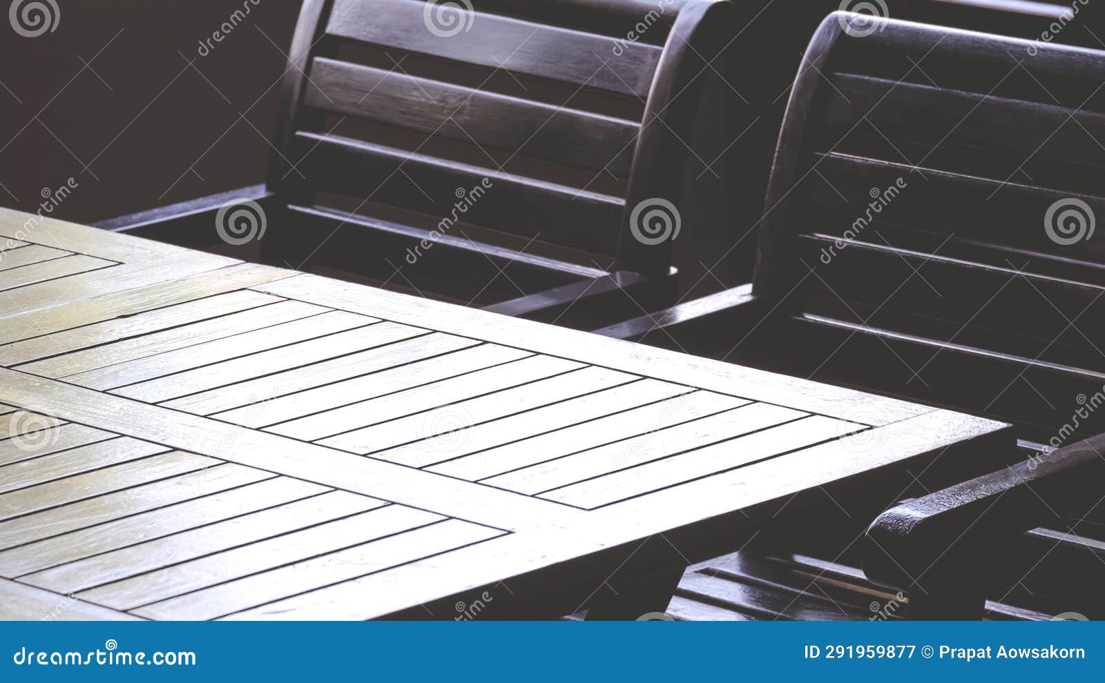Light and Shadow on Surface of Black Hardwood Dining Table Set in ...